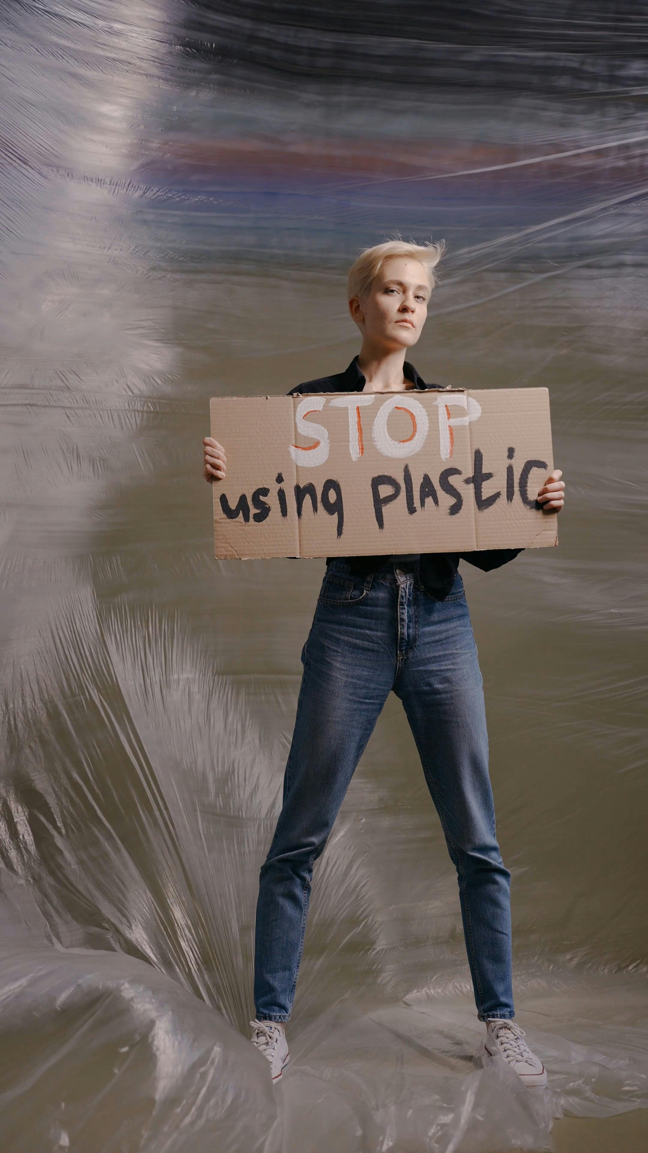 Woman Holding a Stop Using Plastic Poster Free Stock Video Footage ...
