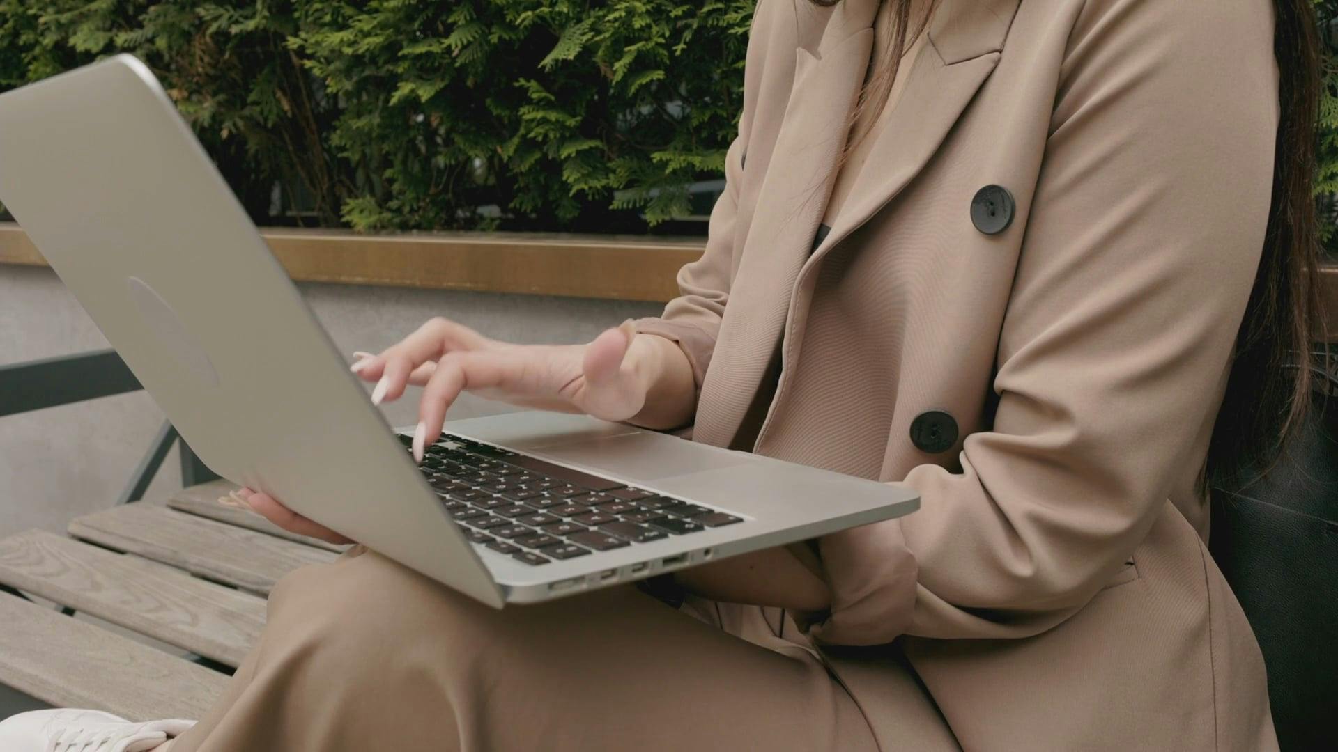 Close-up Shot of a Woman Typing on Her Laptop · Free Stock Video