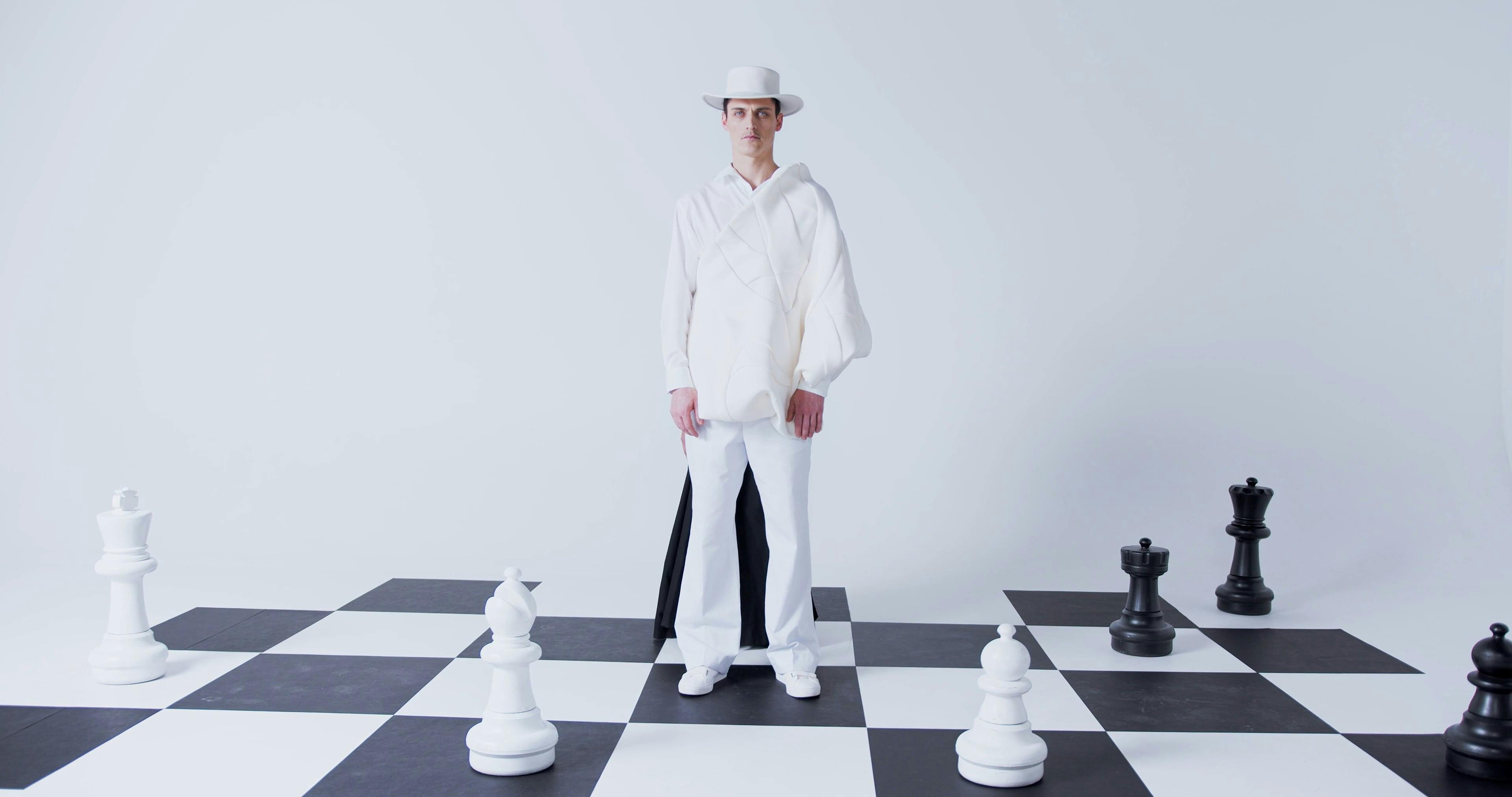 A Man and Woman Standing at the Checkerboard · Free Stock Video