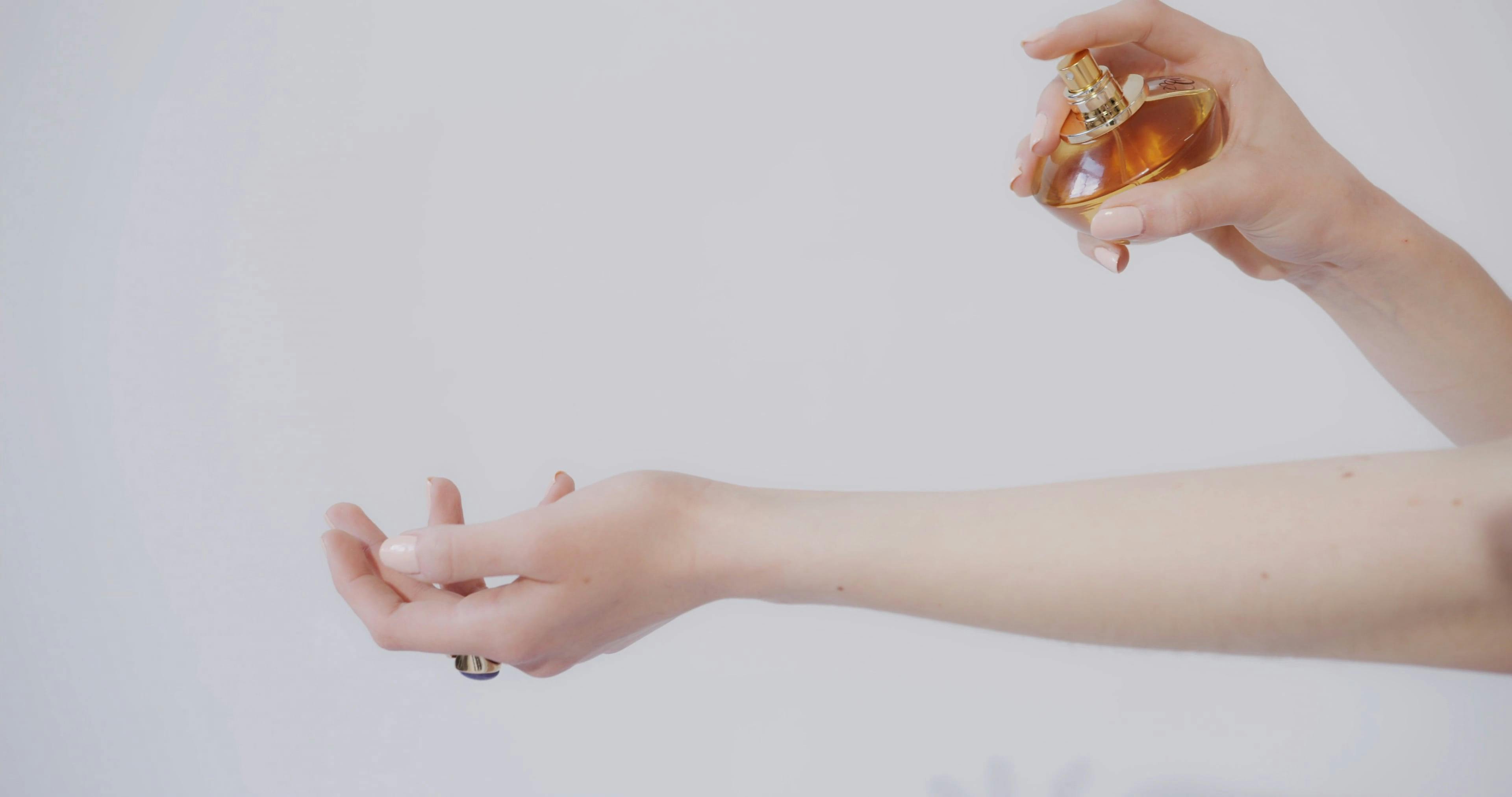 Spraying Perfume on Inner Wrist · Free Stock Video