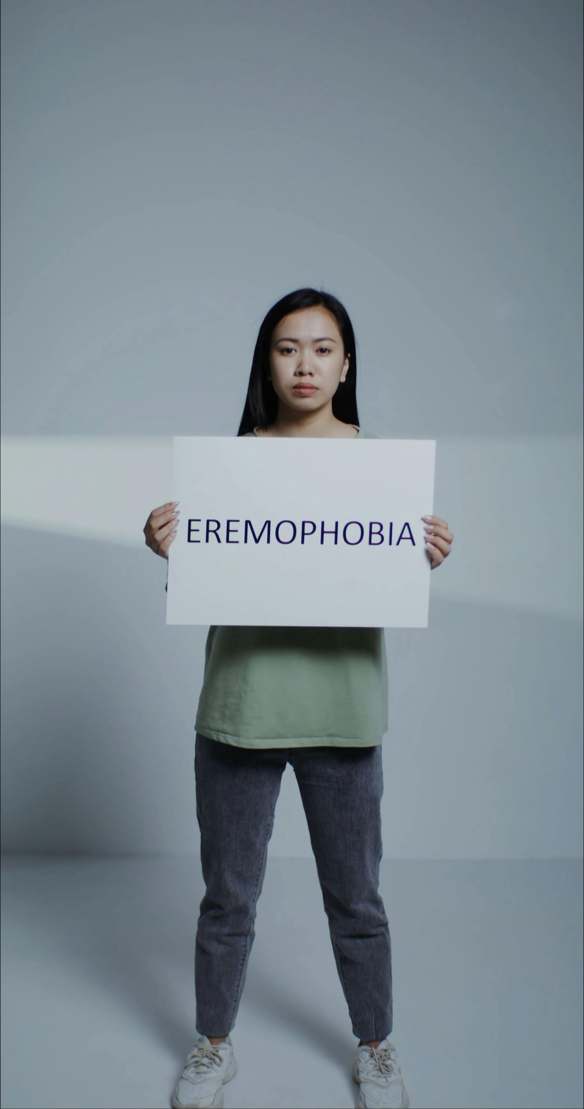 Woman Holding A Sign Of Eremophobia Free Stock Video Footage, Royalty ...