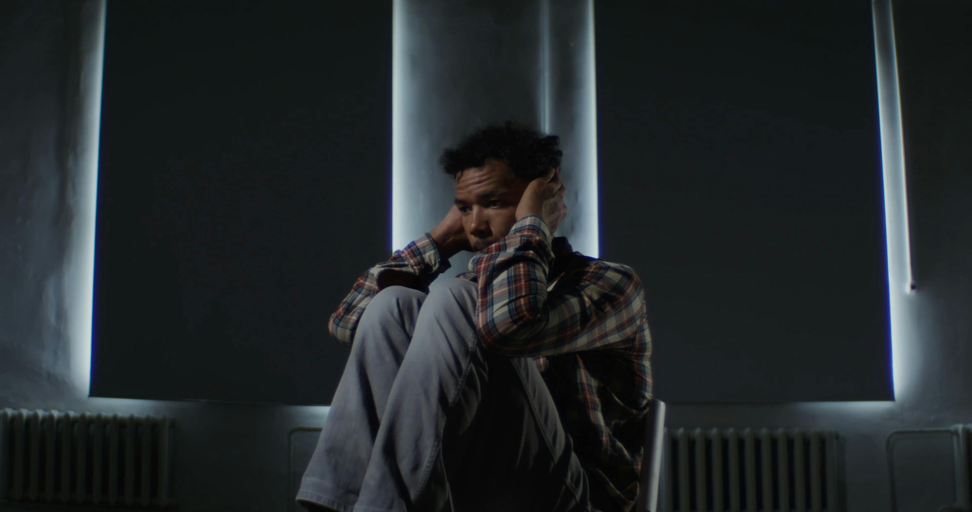 Man Sitting On A Chair Feeling Scared And Alone · Free Stock Video