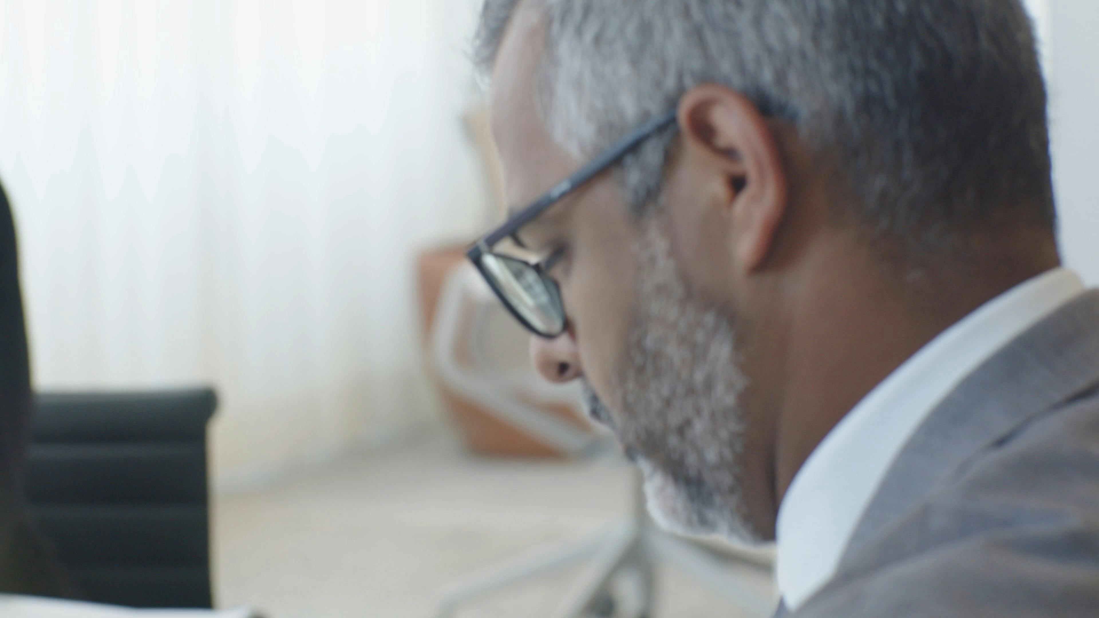 Man Reviewing A Document · Free Stock Video