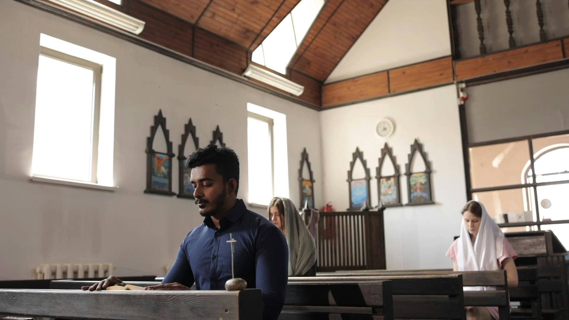 Man and a Woman Sitting Inside a Church · Free Stock Video