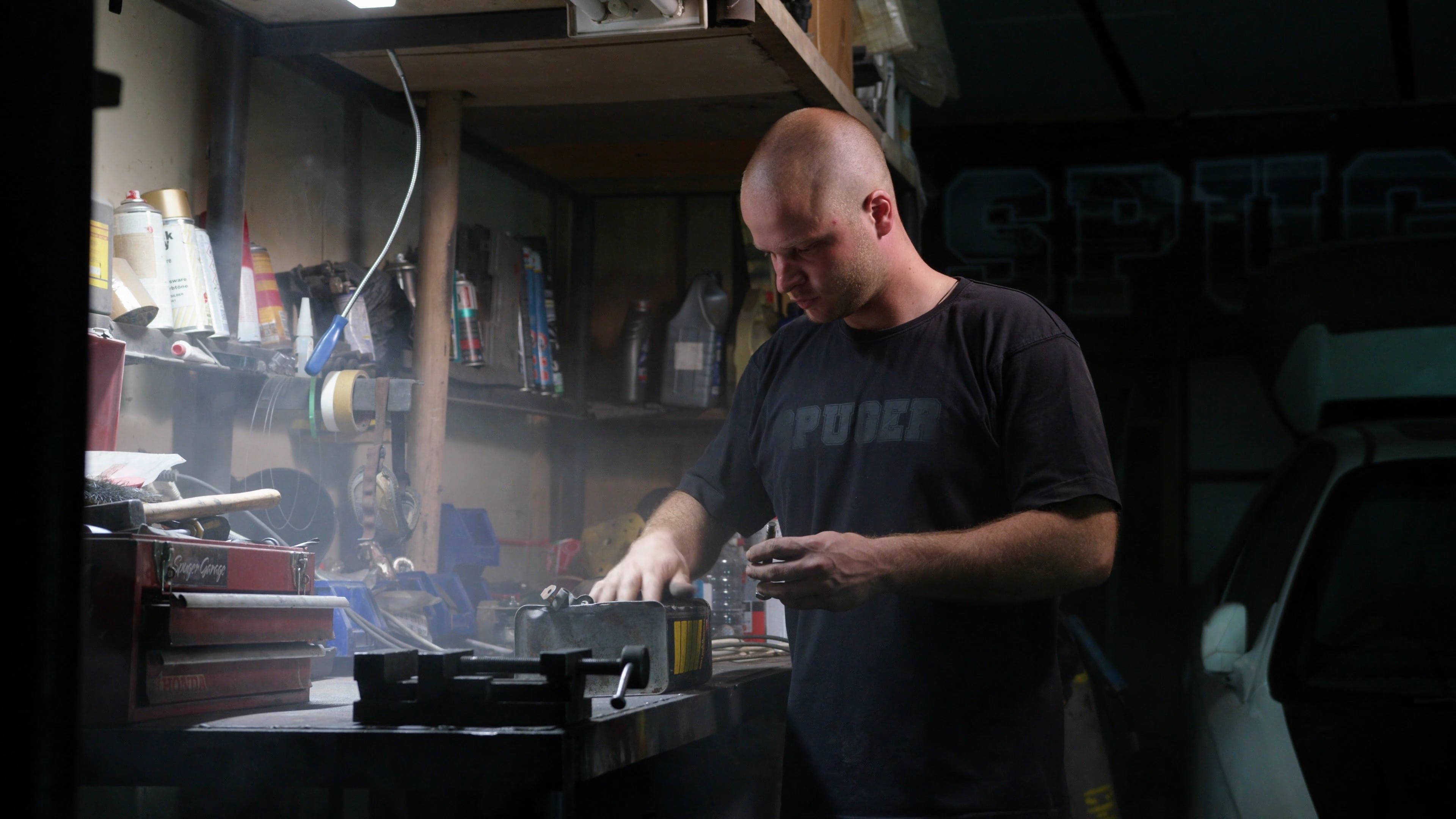 A Man Working in a Garage · Free Stock Video