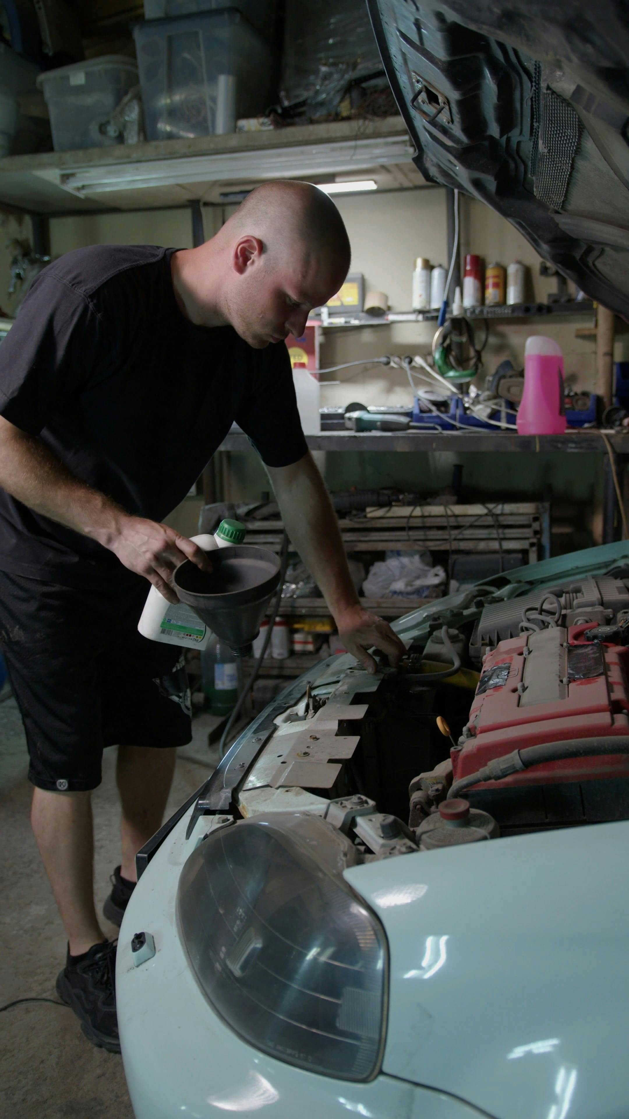 Man Putting Oil in the Car Free Stock Video Footage, Royalty-Free 4K ...