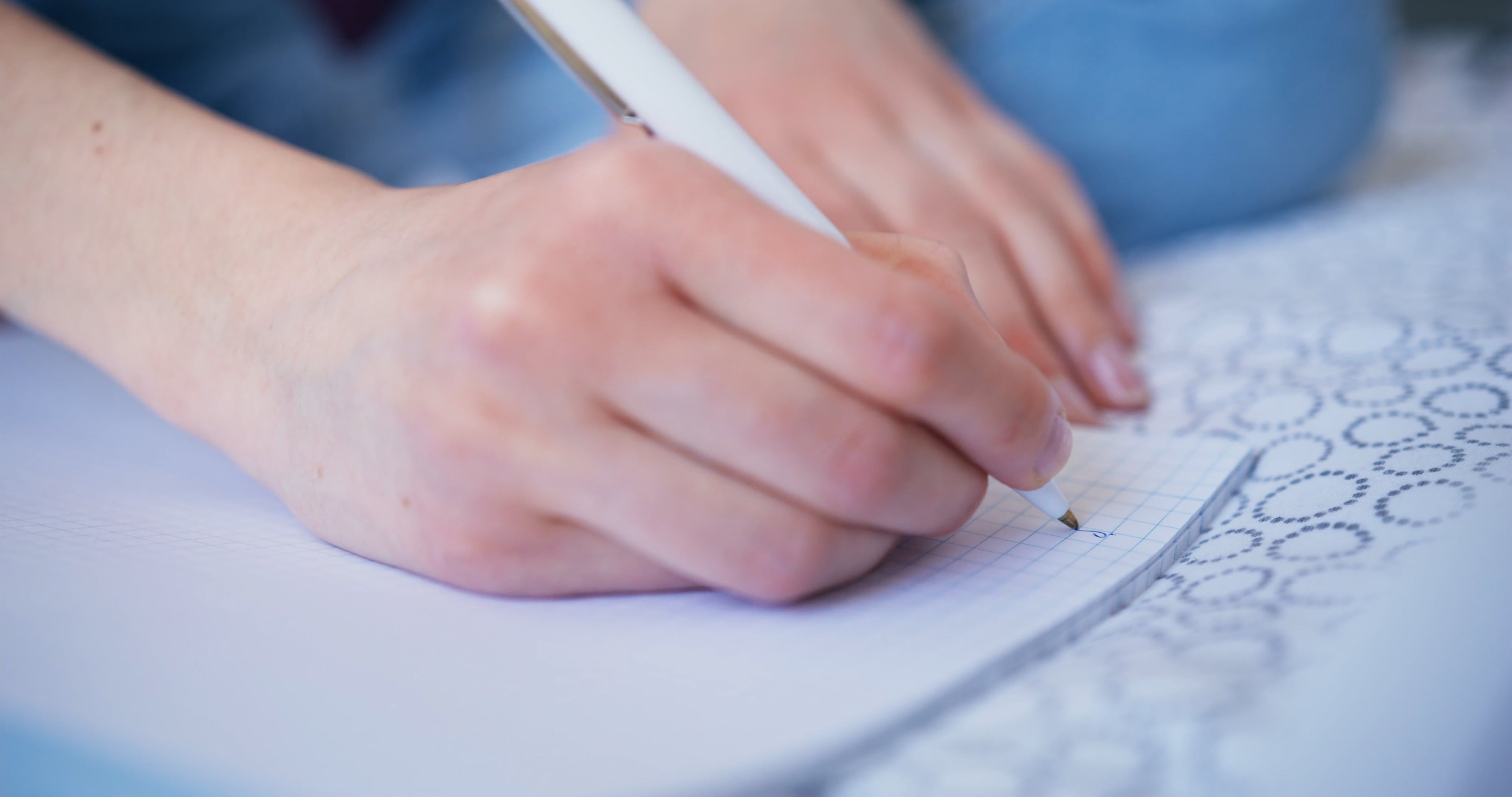 A Close Up of Student Writing on Graphing Paper · Free Stock Video