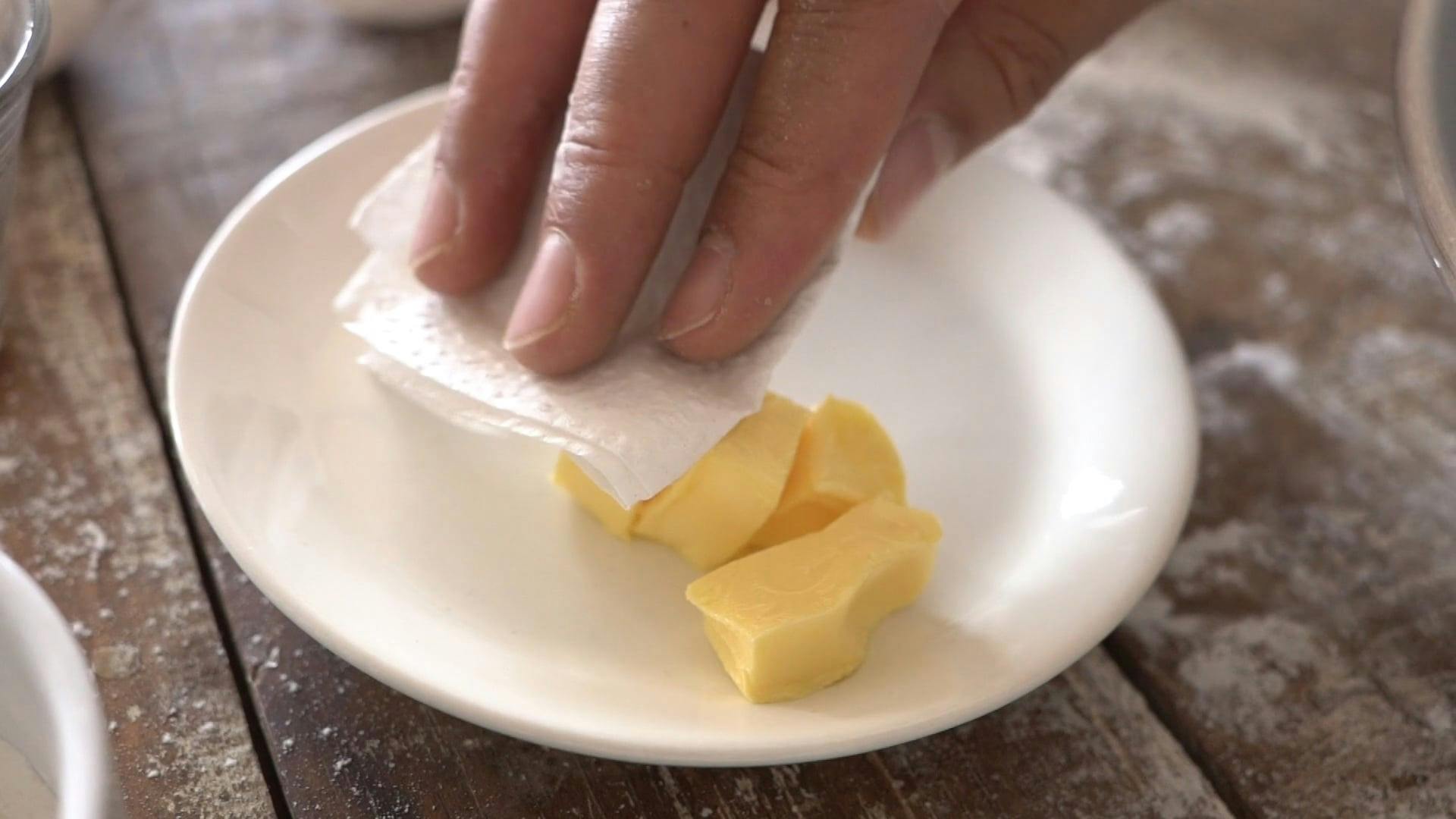 Person Putting Butter in a Baking Pan · Free Stock Video