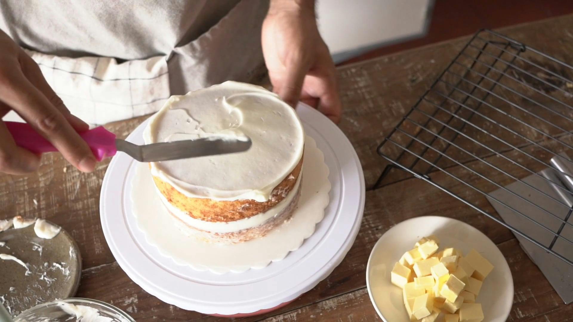 Person Putting Icing in a Cake · Free Stock Video