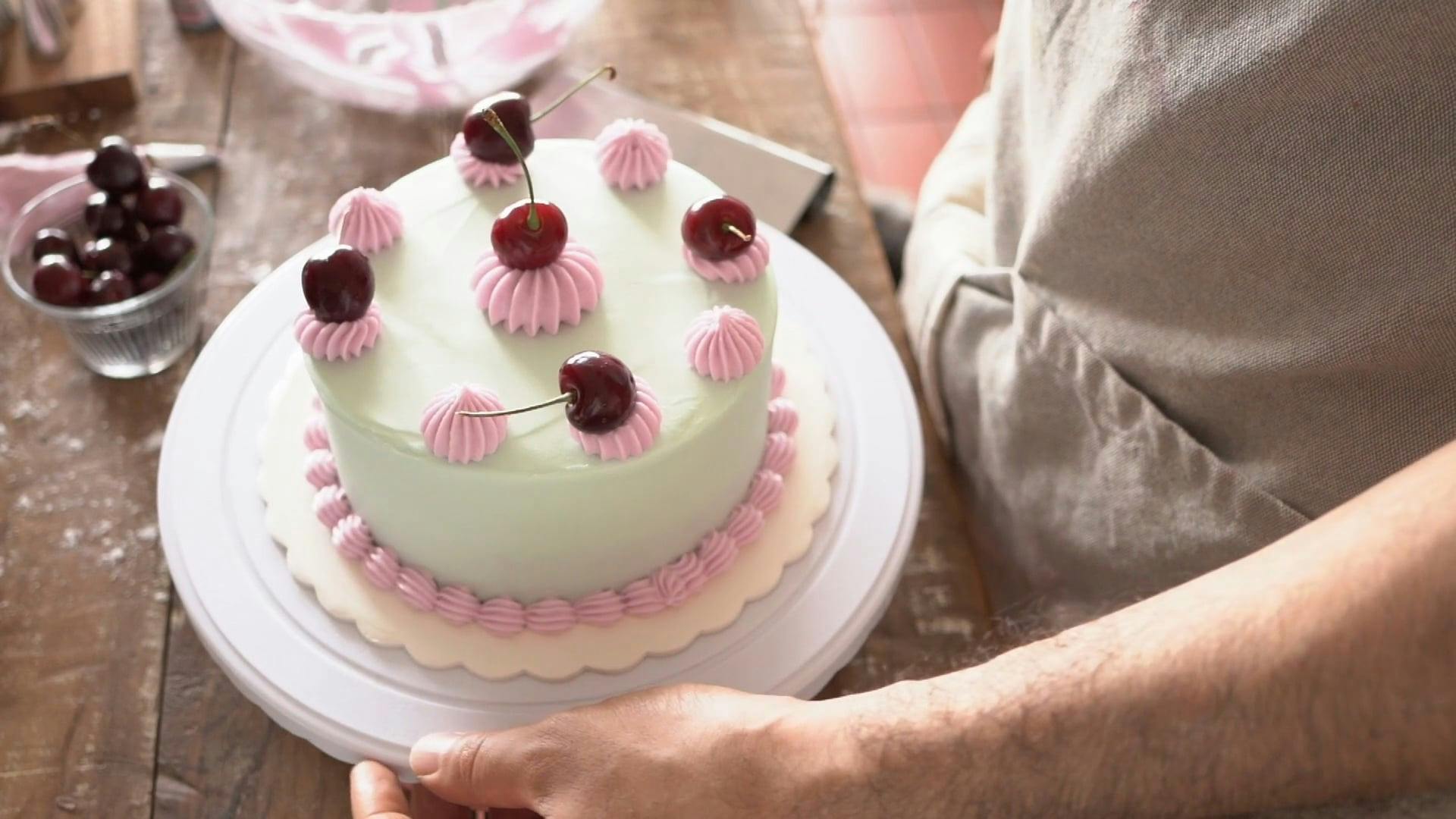 A Person Spinning a Cake on a Cake Stand Free Stock Video Footage ...