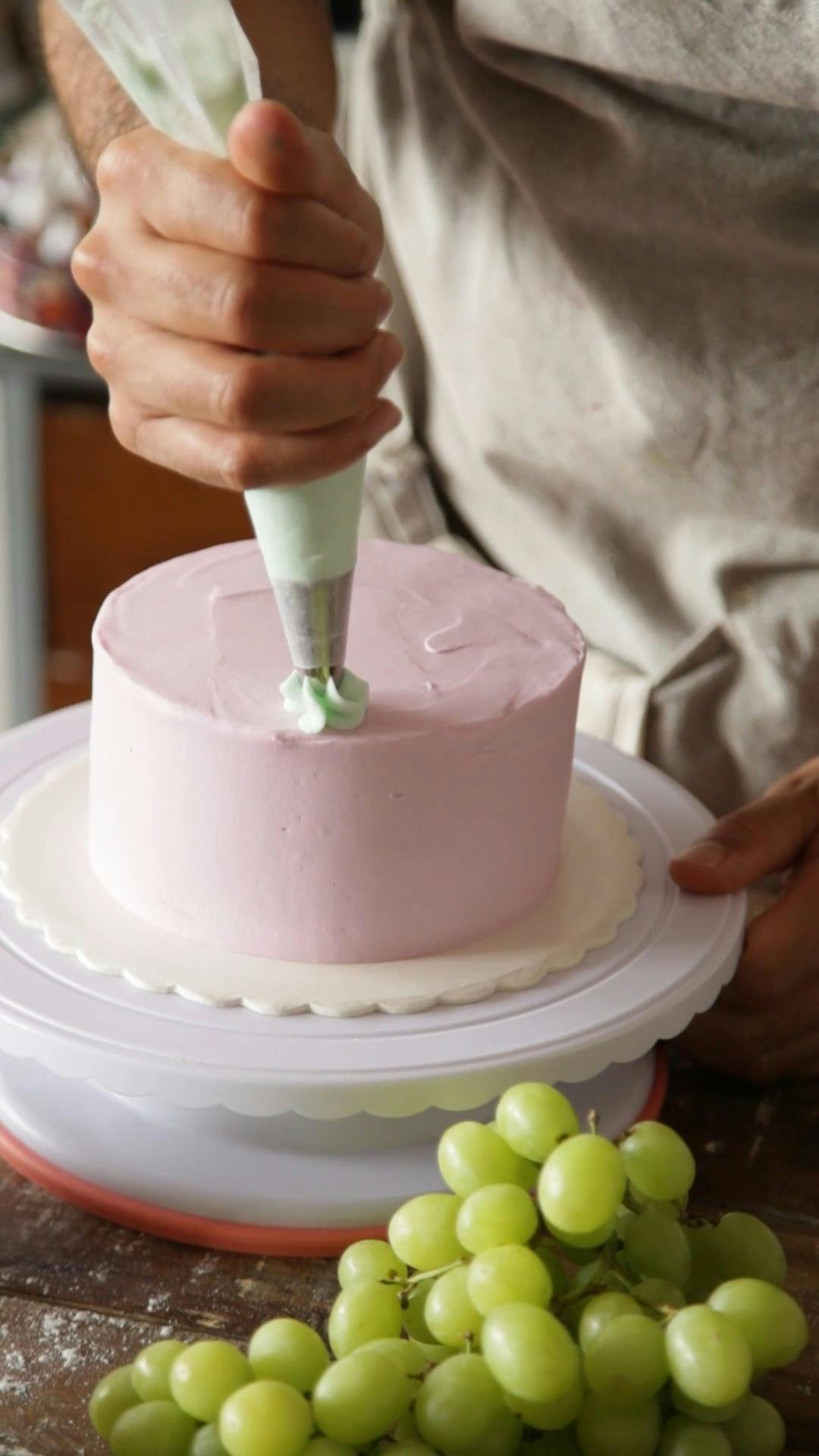 A Person Putting an Icing on the Cake · Free Stock Video