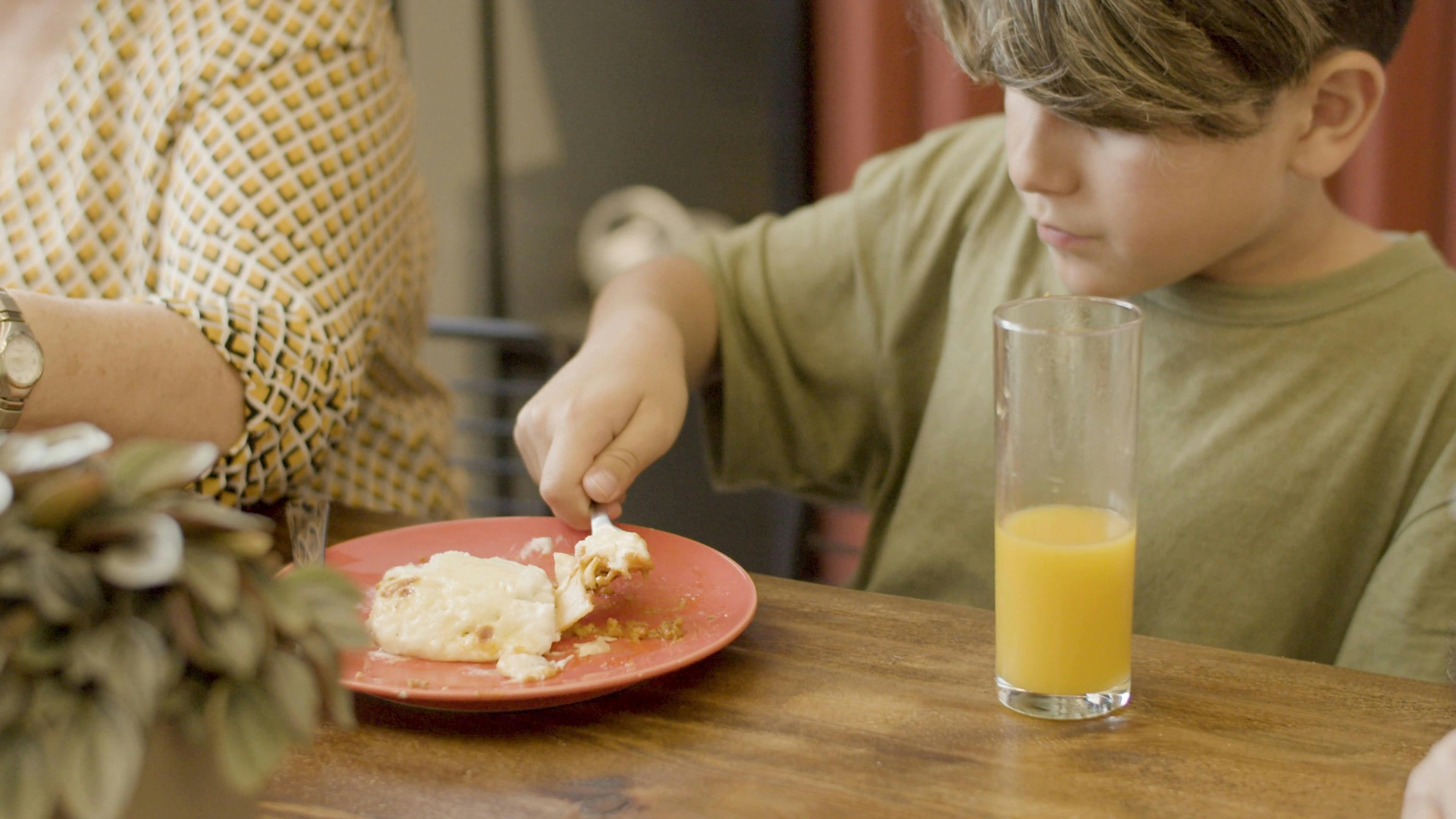 Boy Eating with a Fork · Free Stock Video
