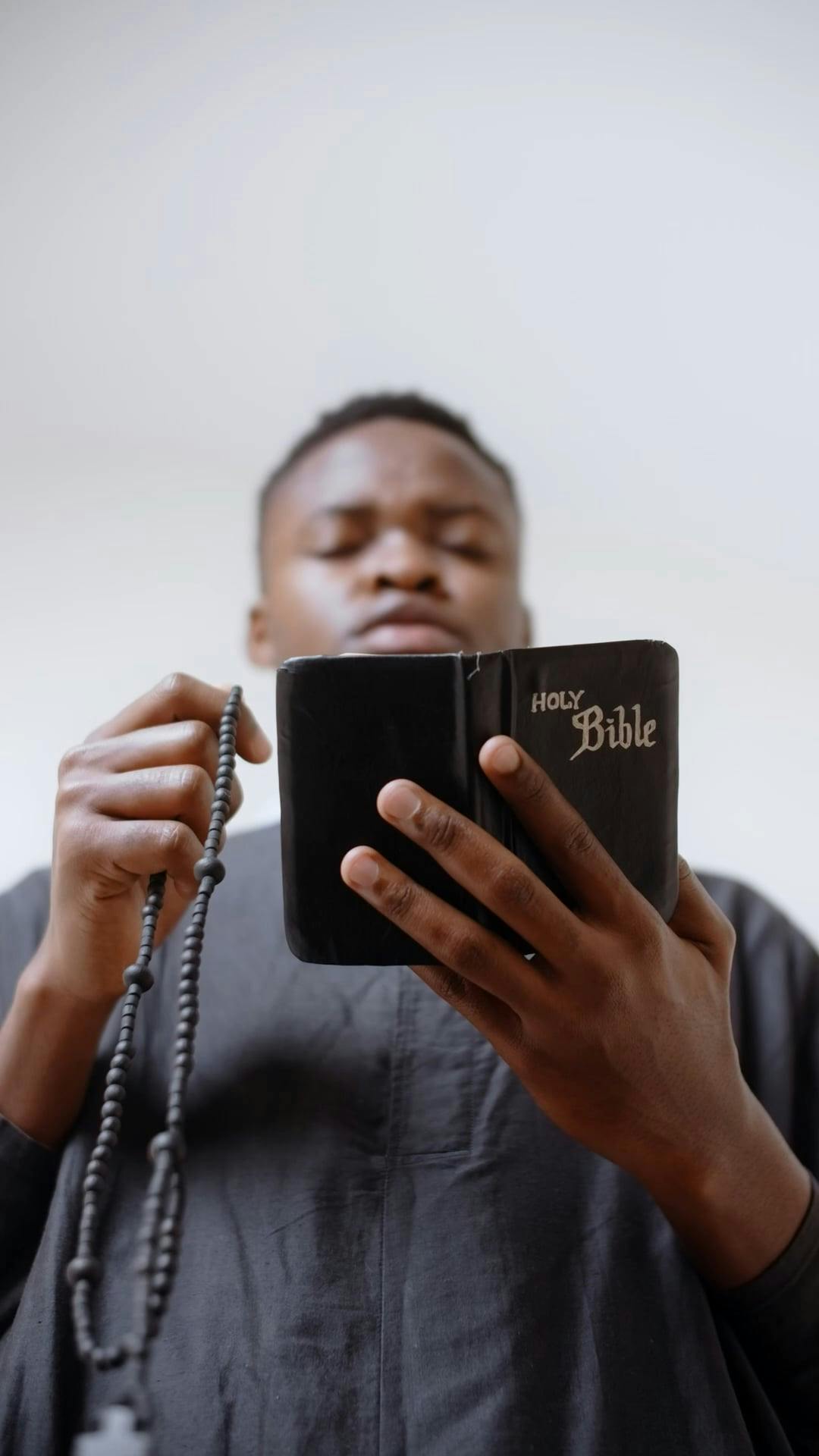 Person Reading a Bible while Sitting on the Grass Free Stock Video ...