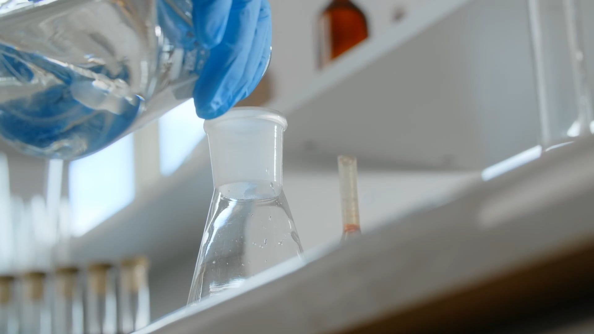 A Person Pouring Liquid in the Flask Free Stock Video Footage, Royalty ...