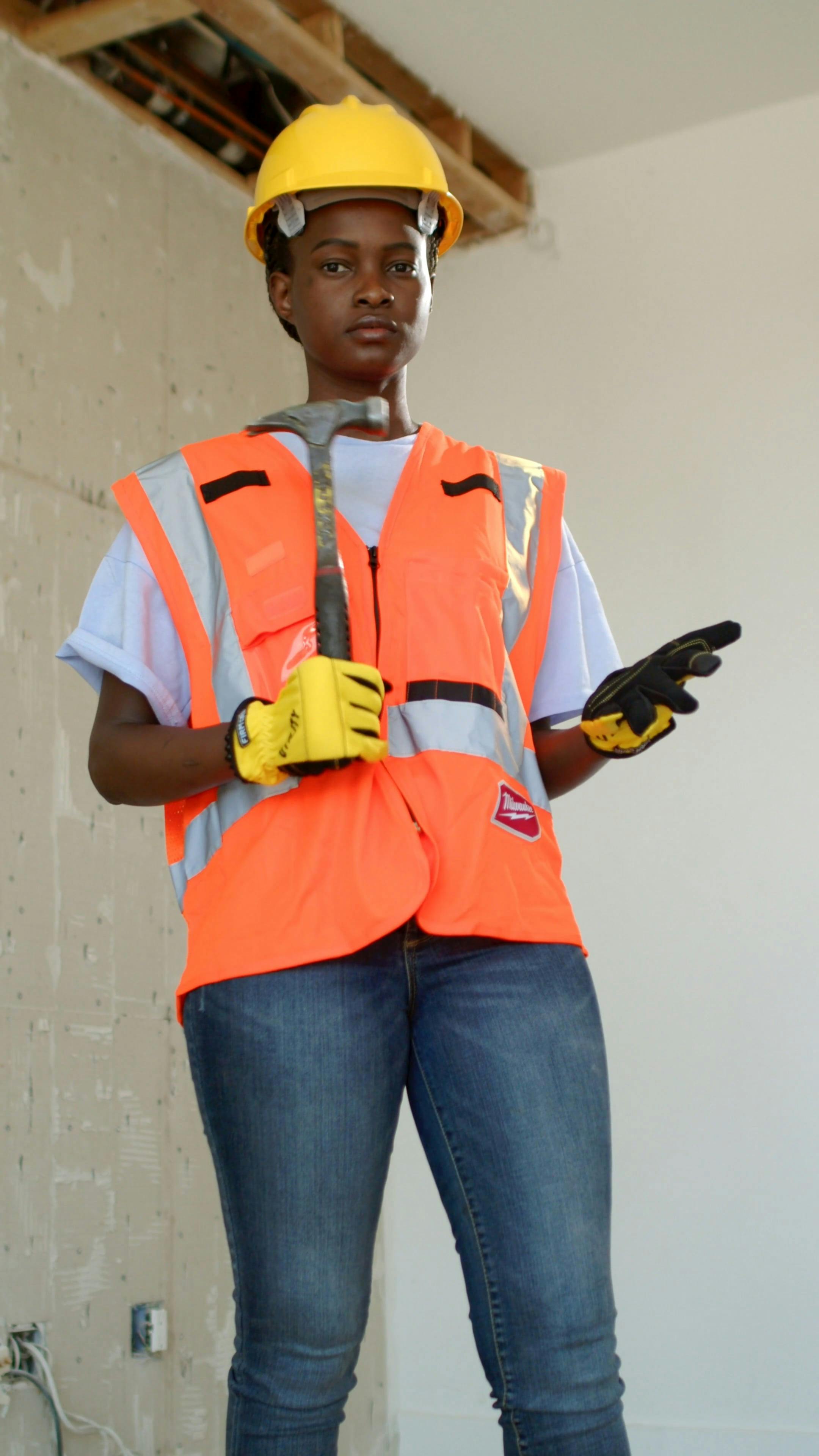 Handywoman Holding a Drill and Hammer · Free Stock Video