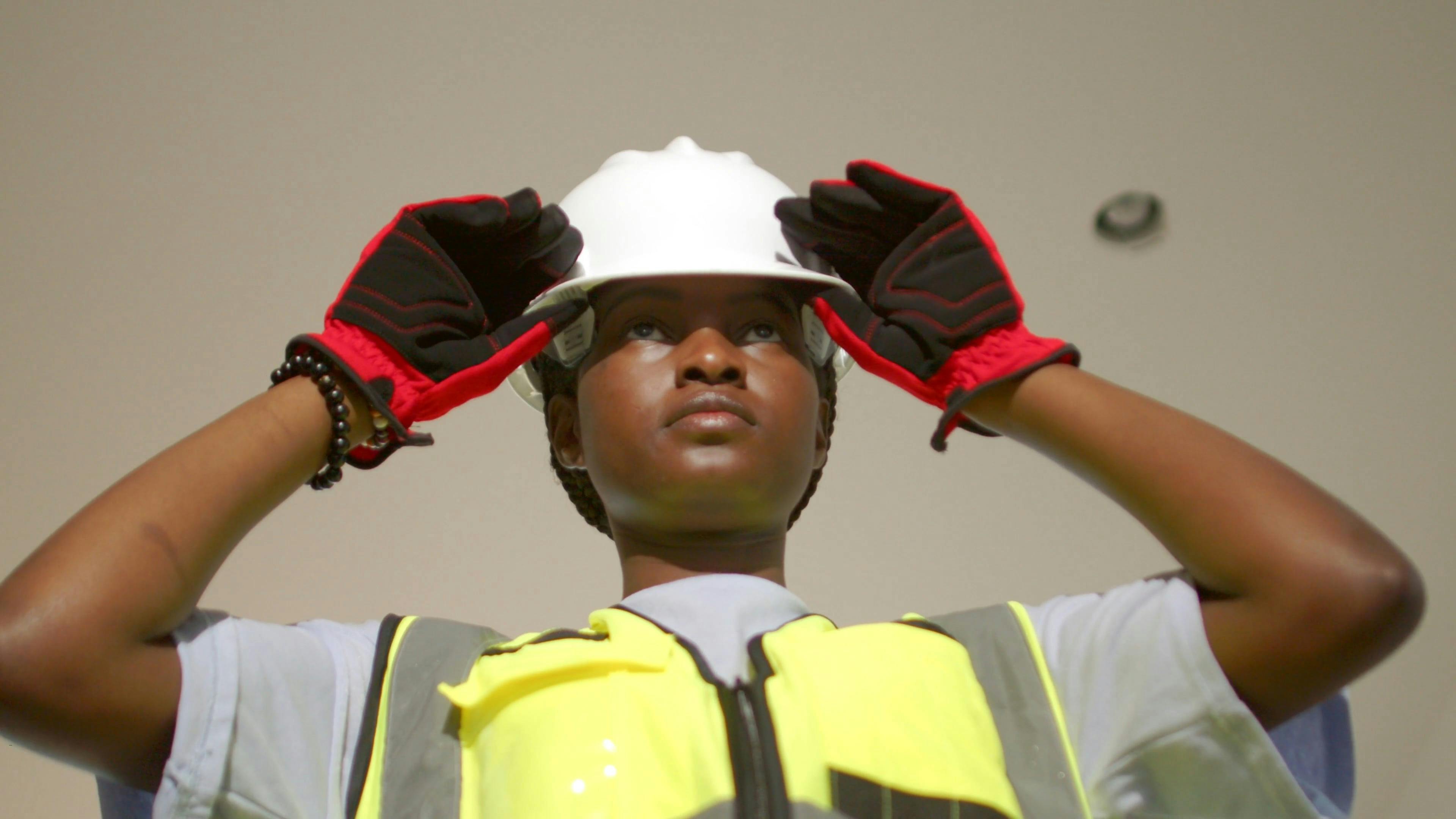 Low Angle Shot of Female Engineer Wiping her Sweat Away · Free Stock Video
