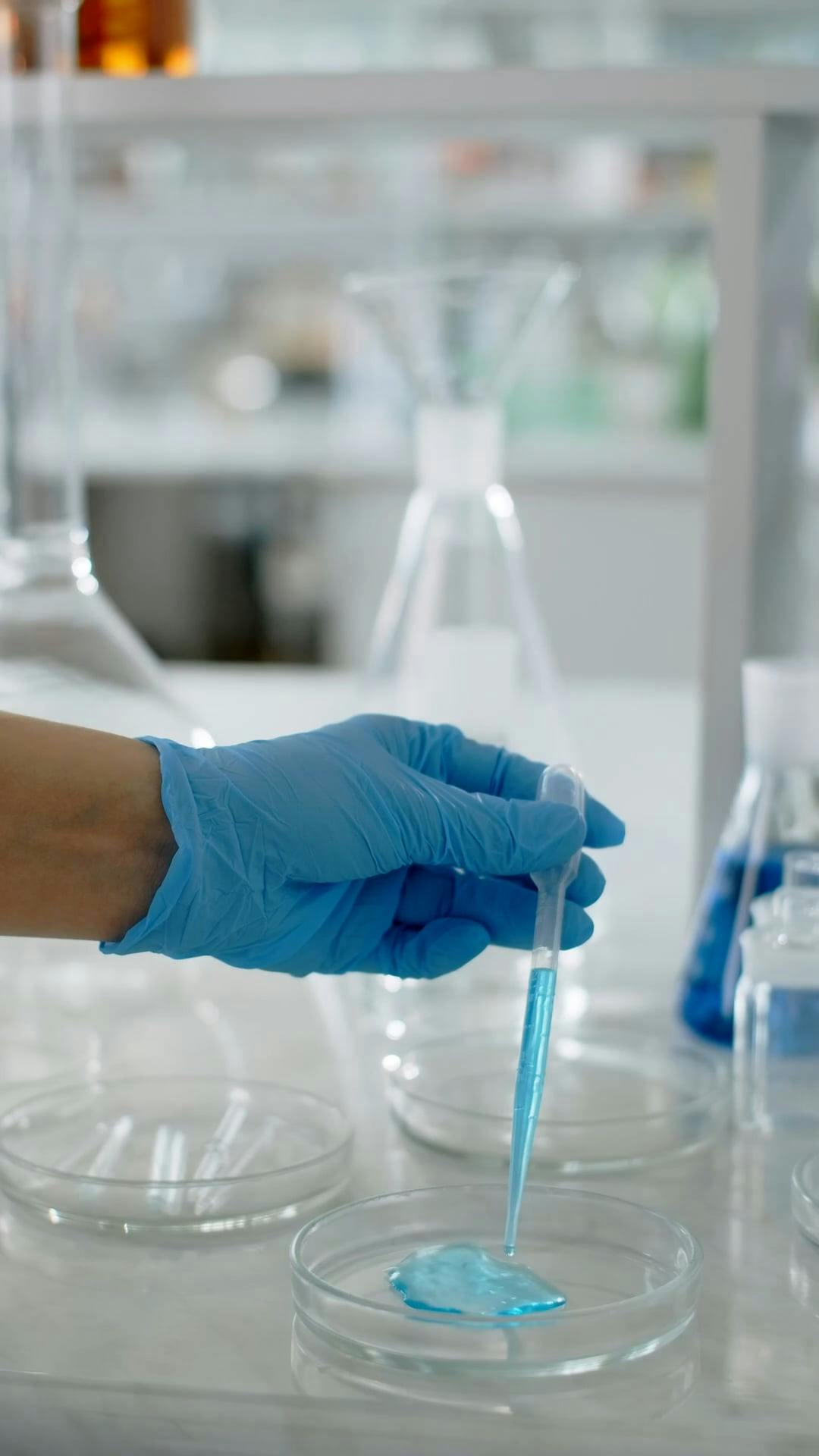 Woman In The Pink Laboratory Coat Opening A Chemical Sample Free Stock ...