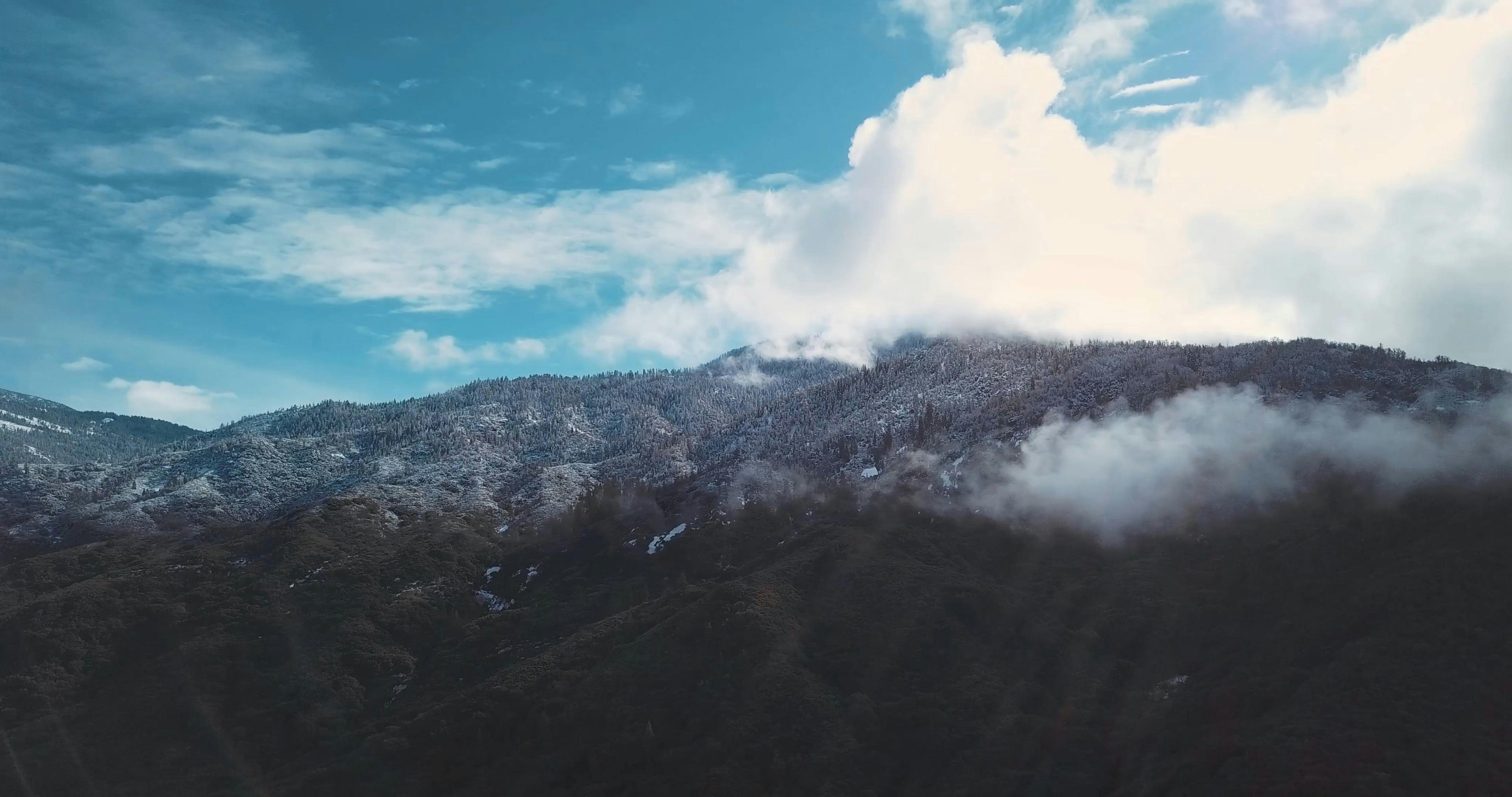 Drone Footage Of Clouds On Top of a Mountain · Free Stock Video