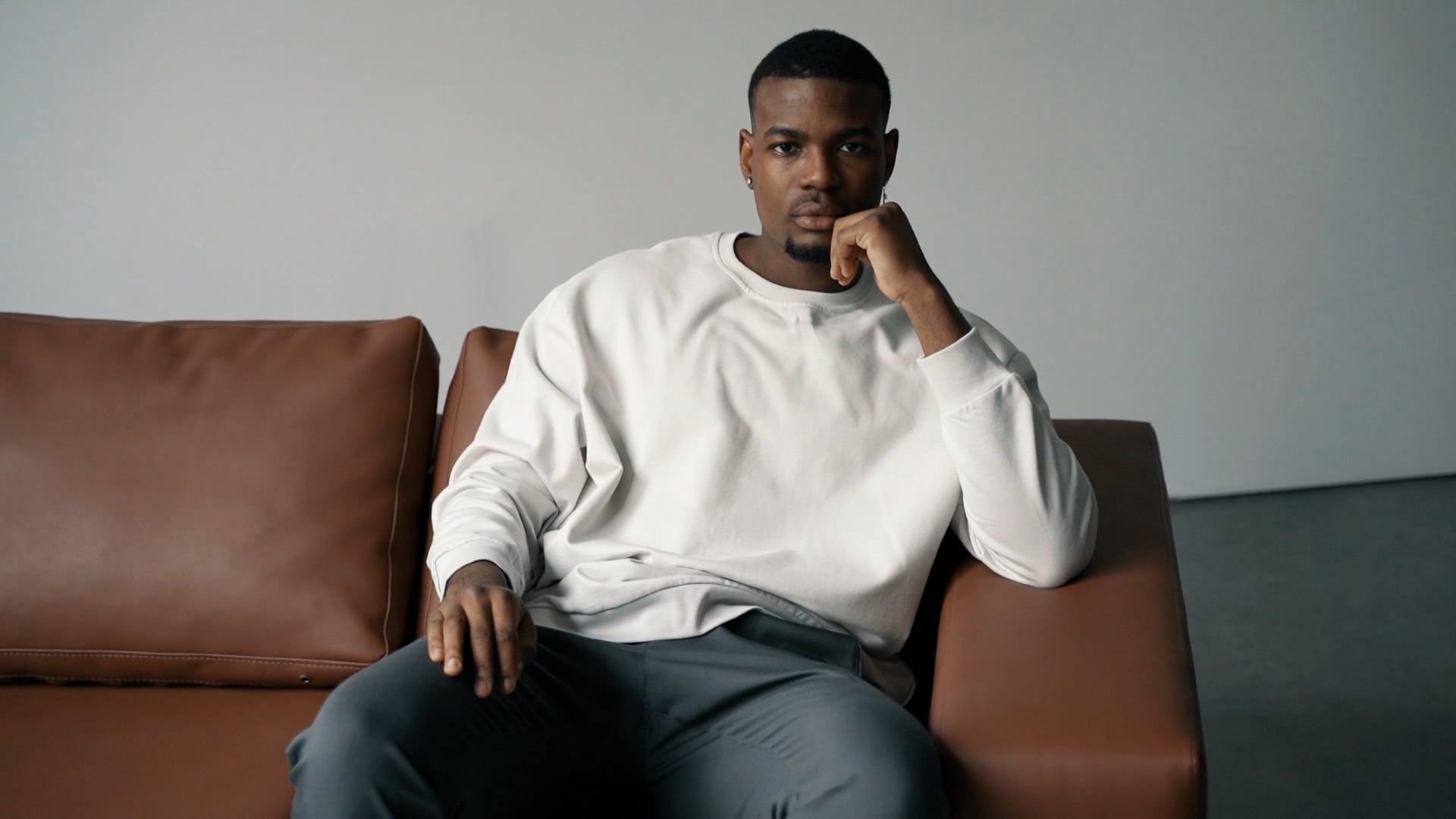 A Man Posing while Sitting on a Couch Free Stock Video Footage, Royalty ...