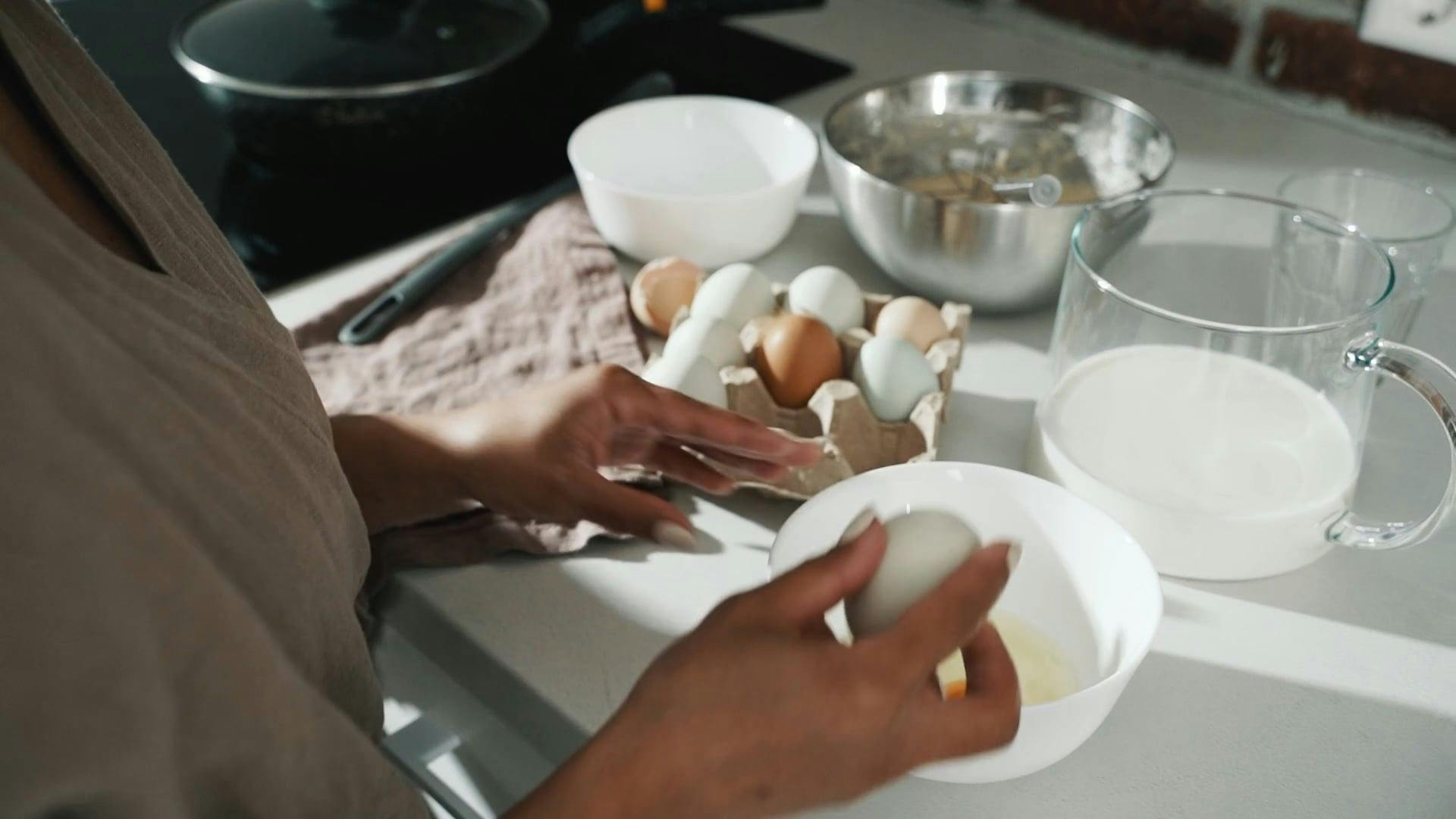 Person Cracking an Egg · Free Stock Video