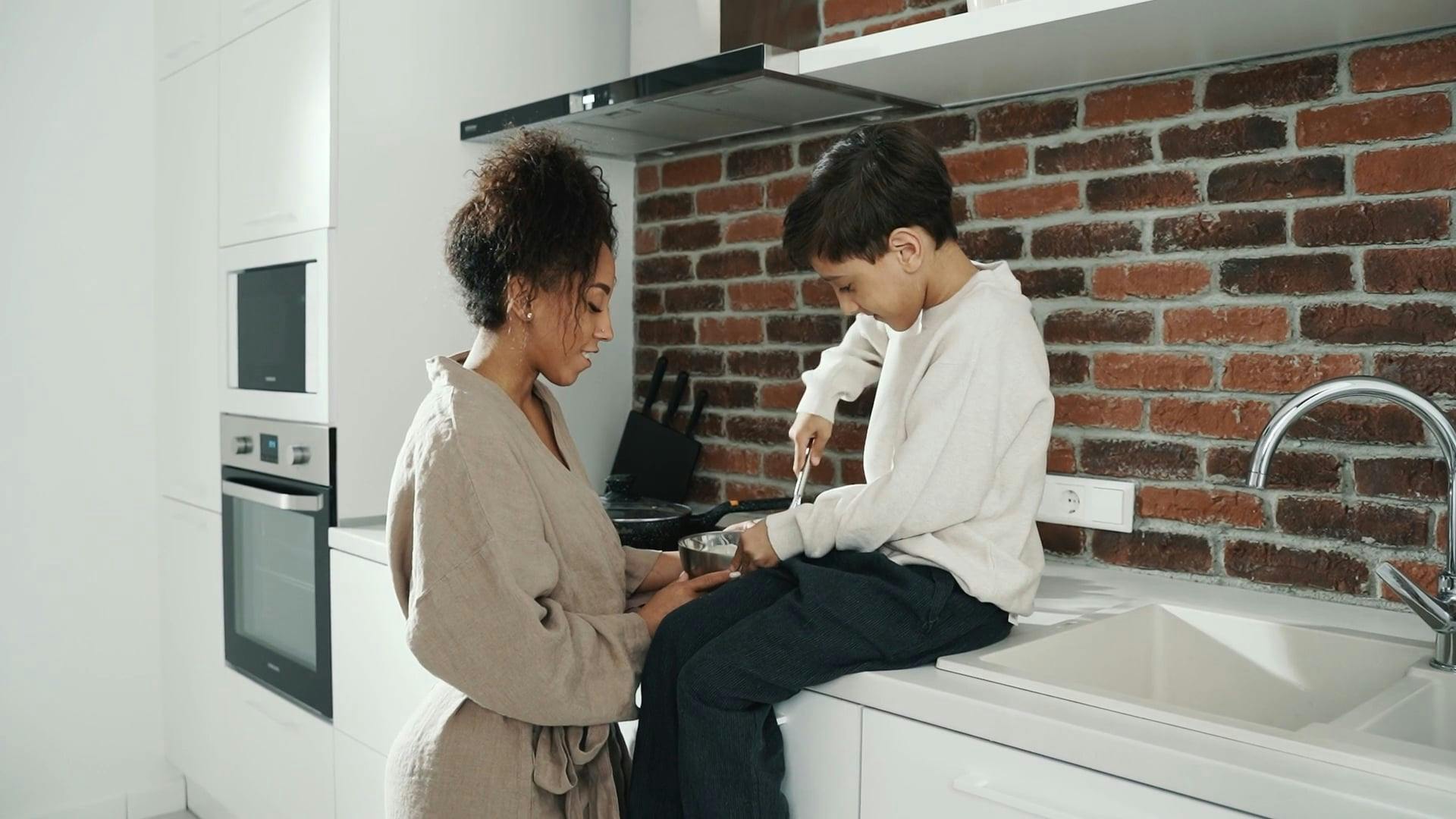 Boy Sitting on Kitchen Counter · Free Stock Video