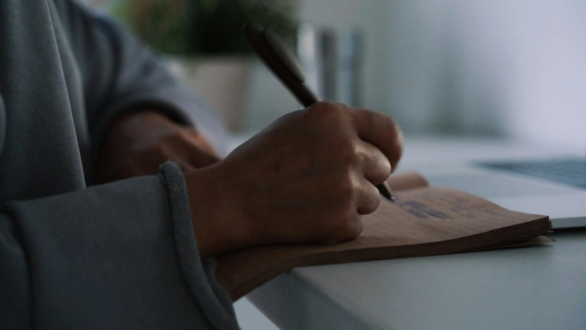 A Person Writing in a notebook Free Stock Video Footage, Royalty-Free ...