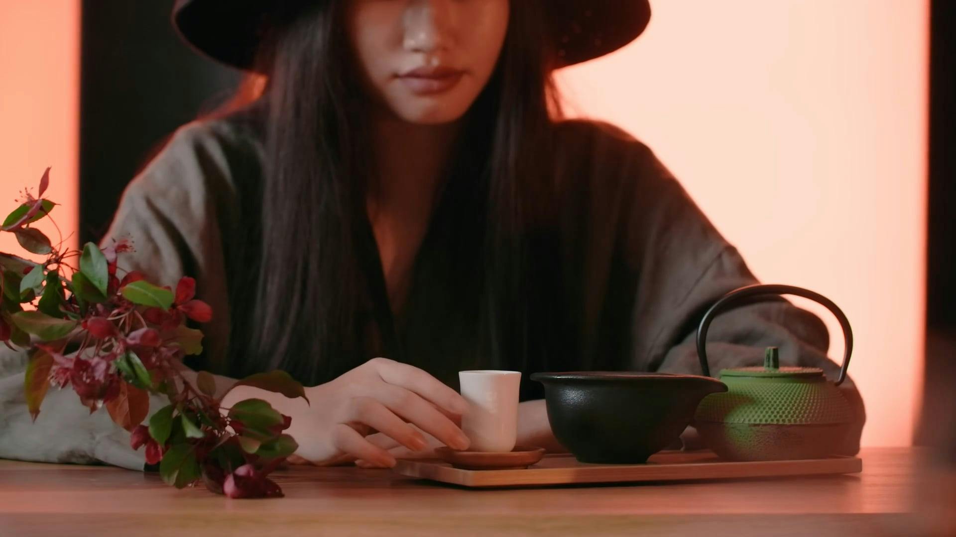 A Woman Drinking Tea at a Table · Free Stock Video