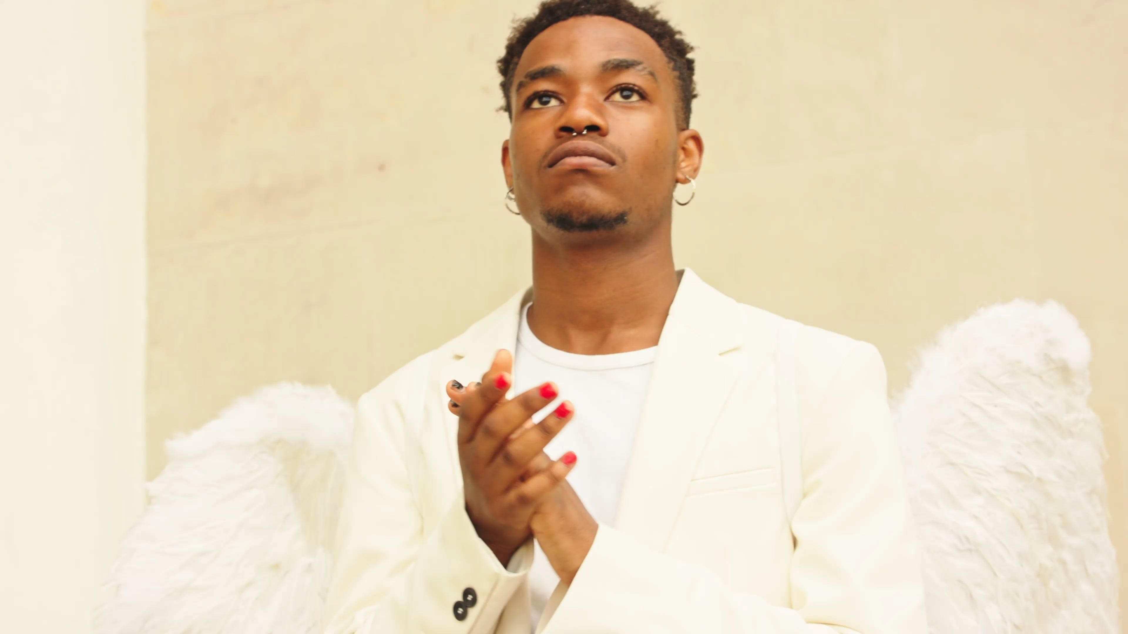 A Male Angel Rubbing his Hands Together · Free Stock Video