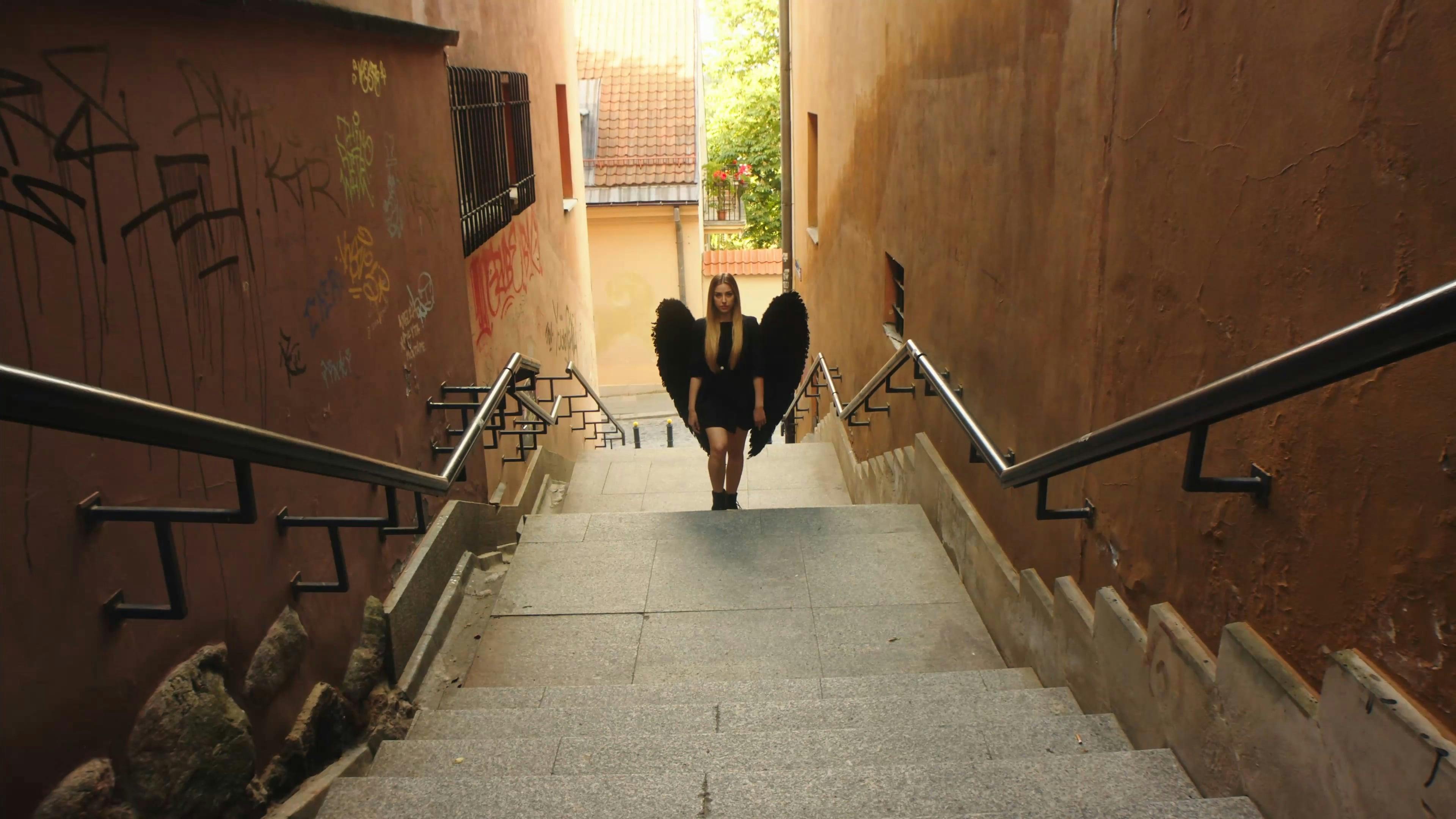 A Dark Angel Walking Up the Stairs · Free Stock Video