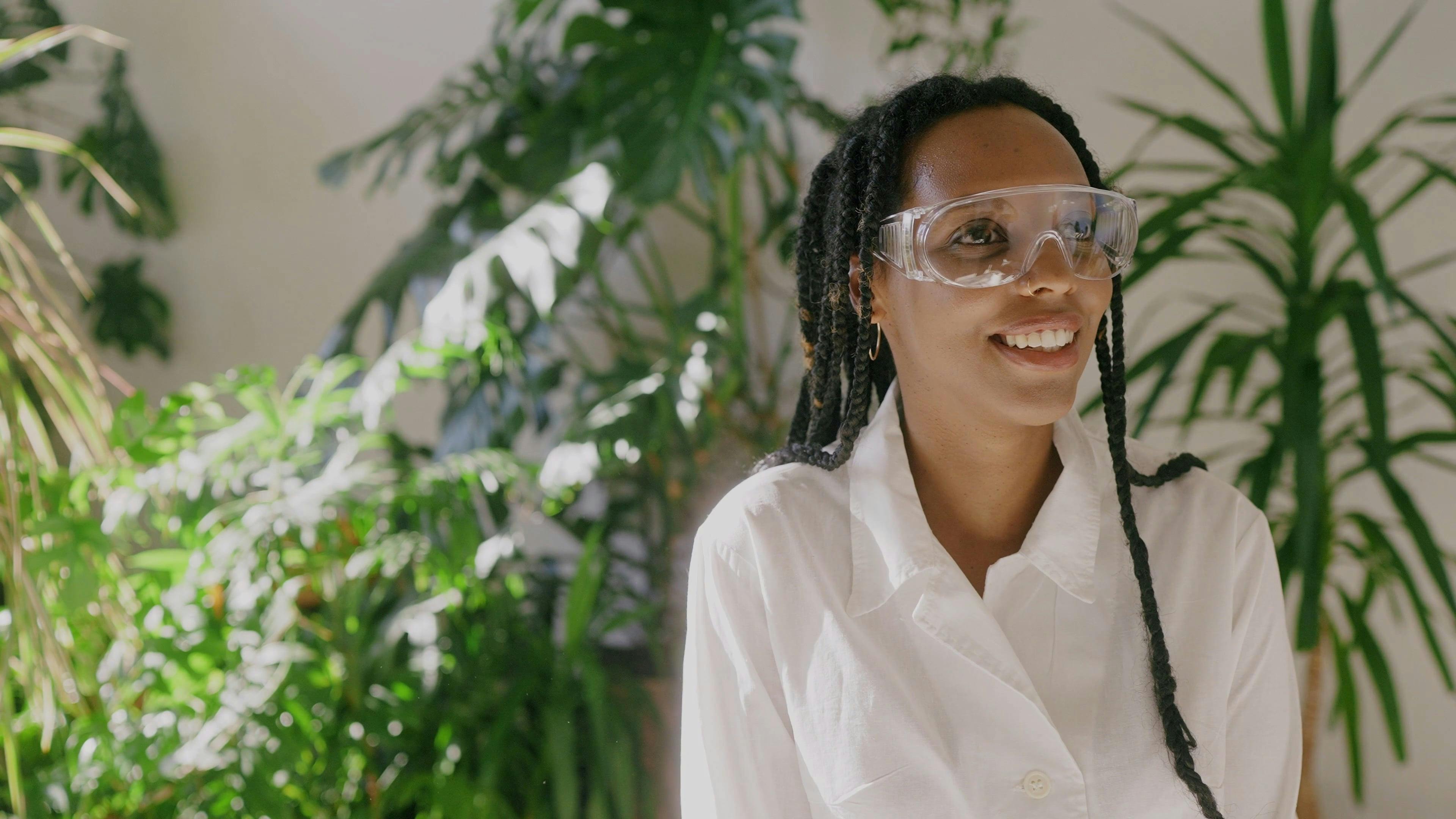 A Female Botanist Posing in a Room Full of Plants Free Stock Video ...