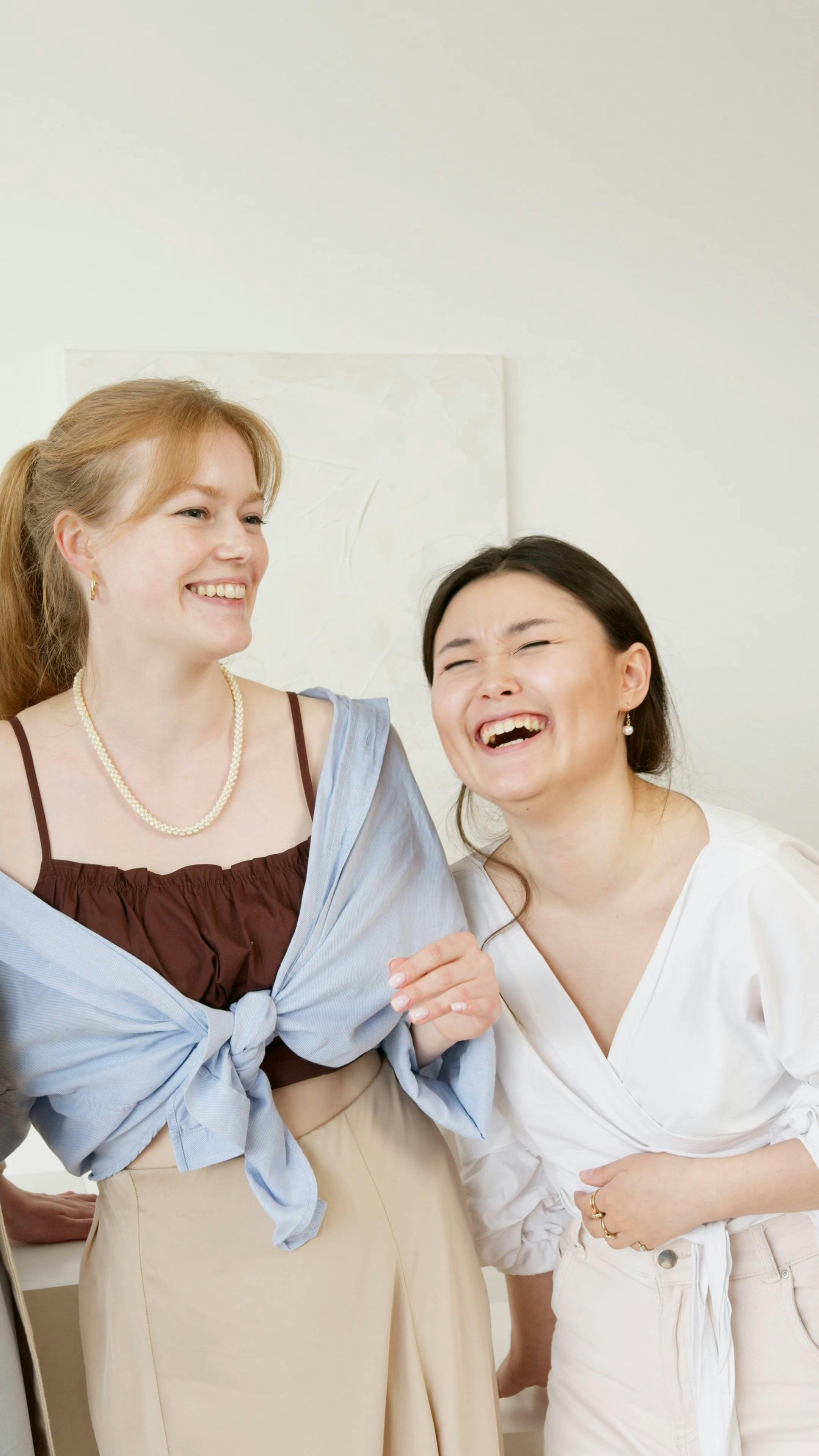 A Woman Smiling While In A Conversation With A Group Of People Free ...