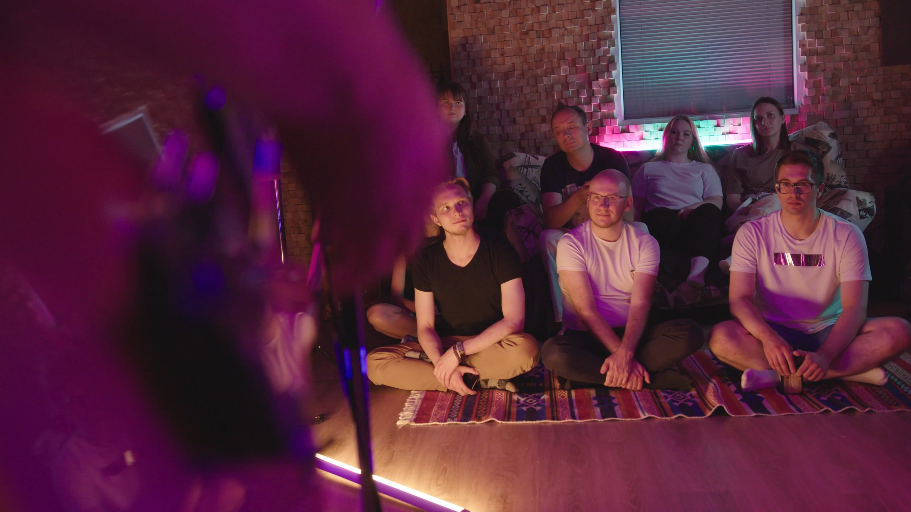 A Group of People Watching a Concert in a Room · Free Stock Video