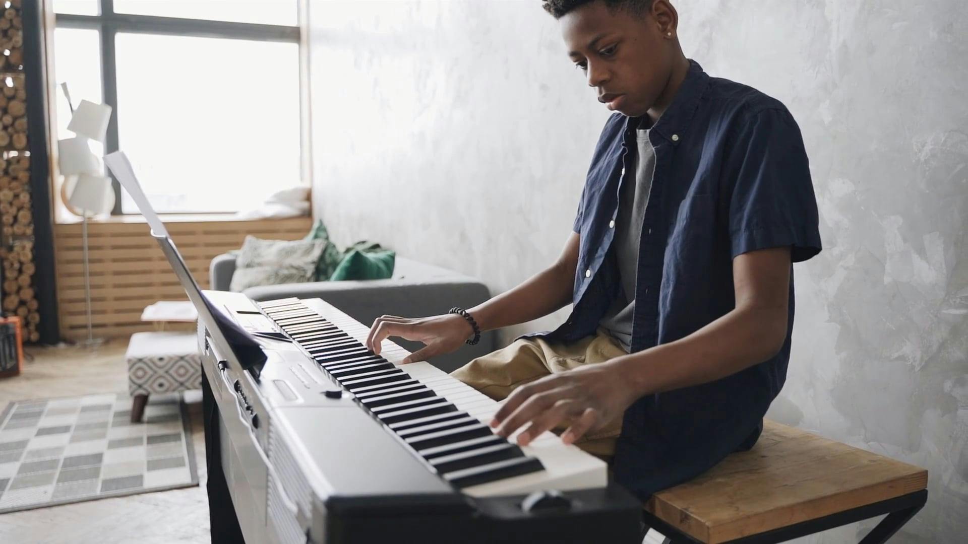 A Boy Playing the Keyboard · Free Stock Video