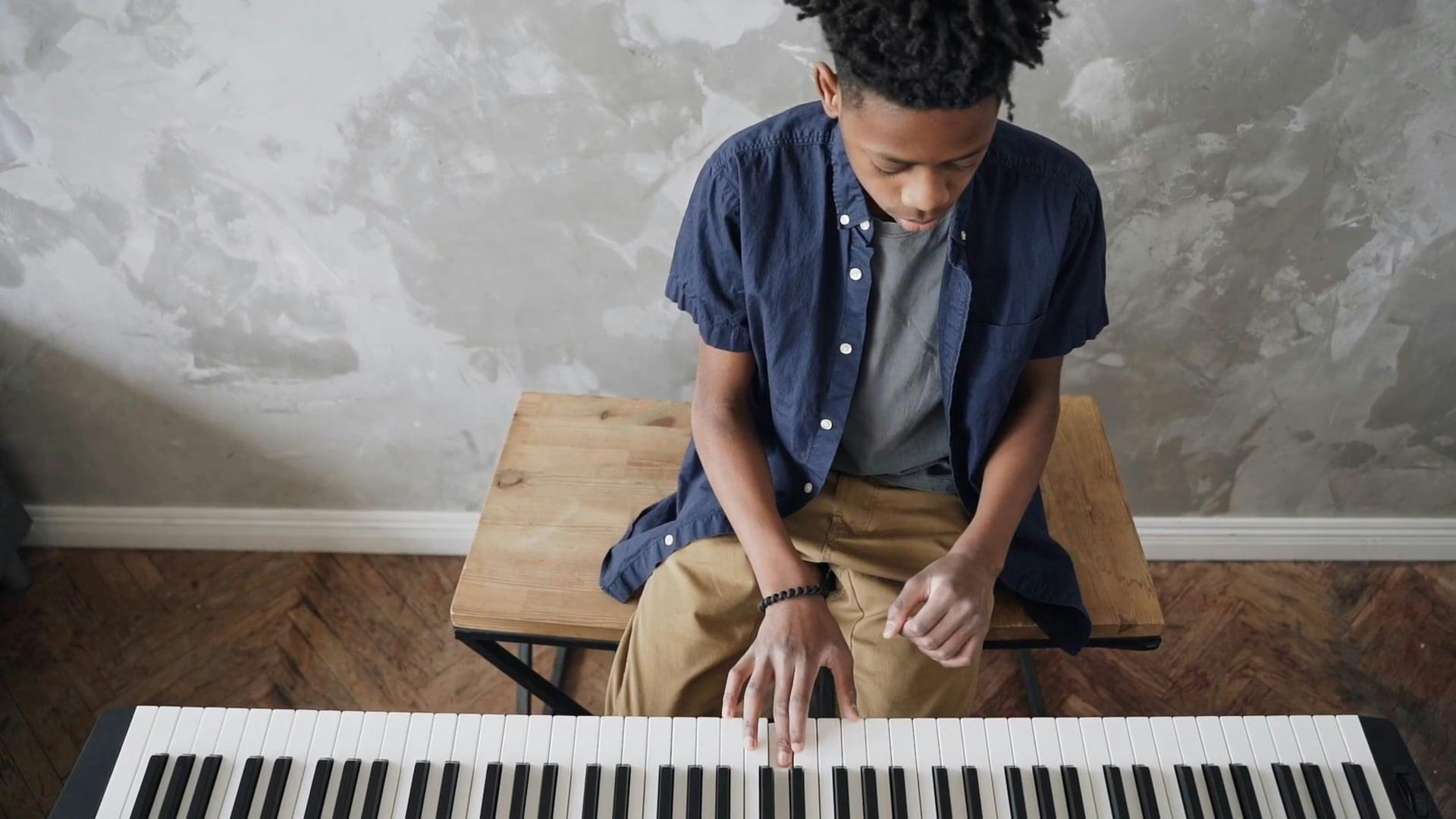 A Boy Playing the Keyboard · Free Stock Video