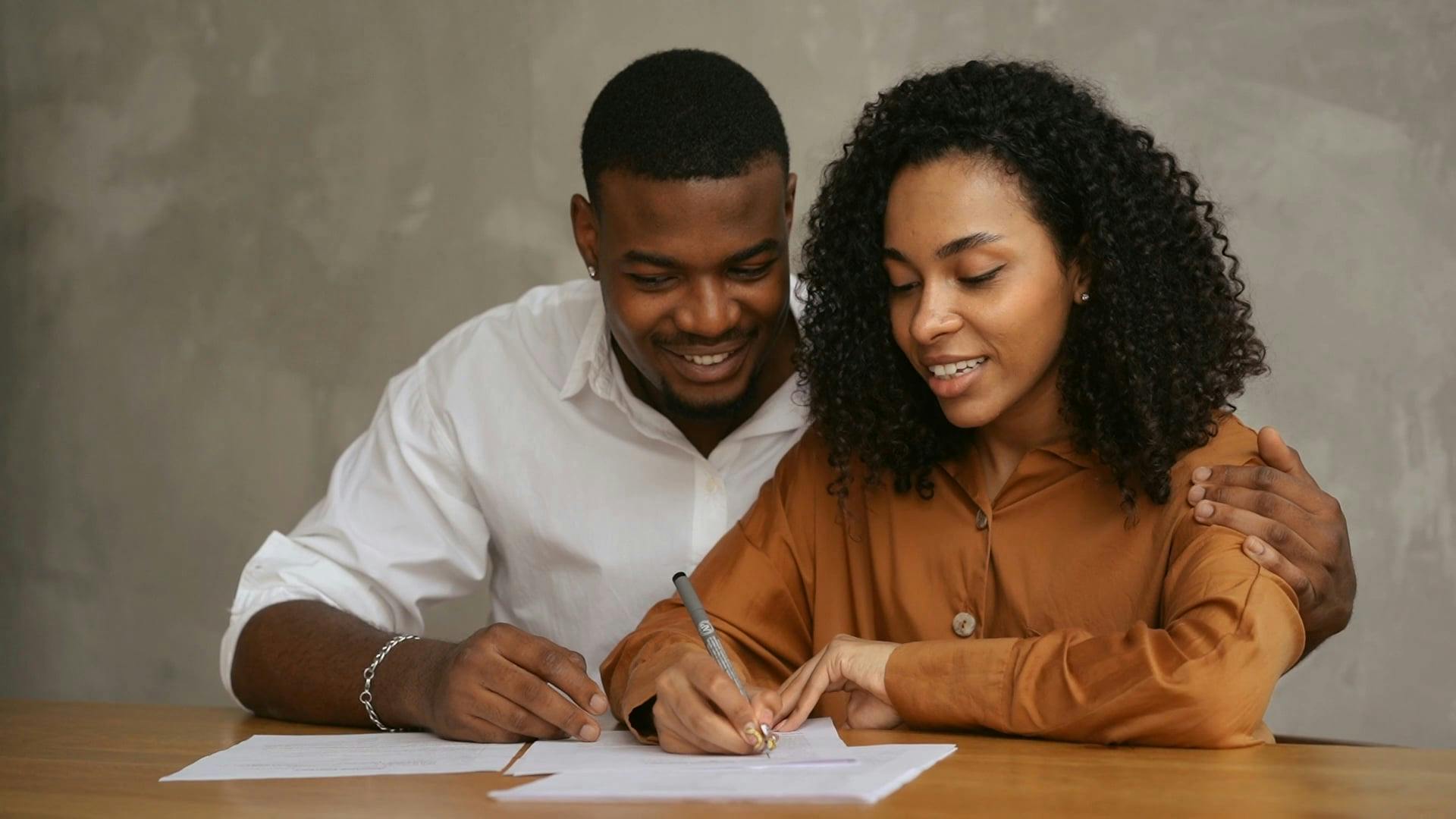 A Couple Talking while Writing on Documents Free Stock Video Footage ...