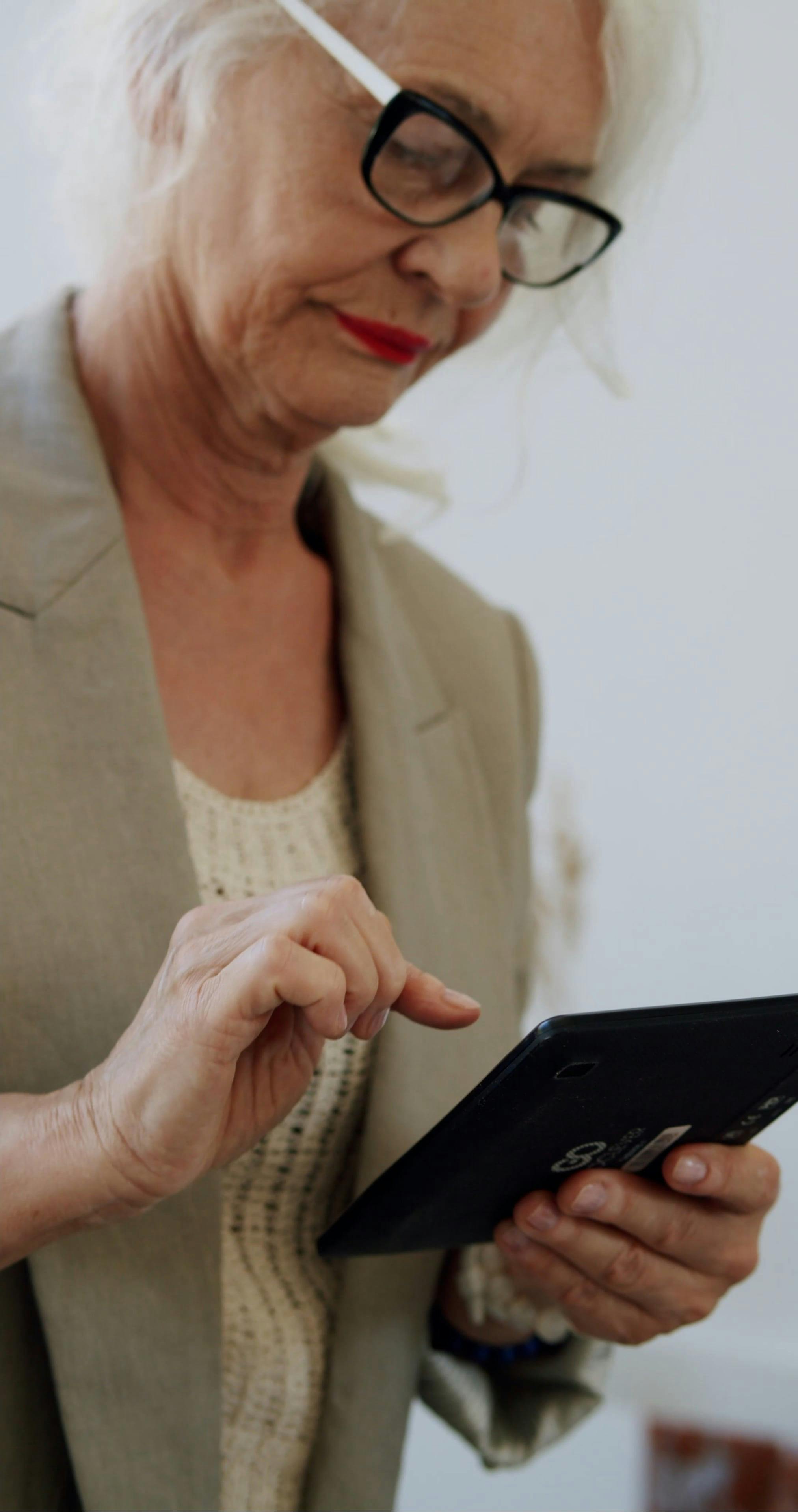 An Elderly Woman Using a Tablet · Free Stock Video
