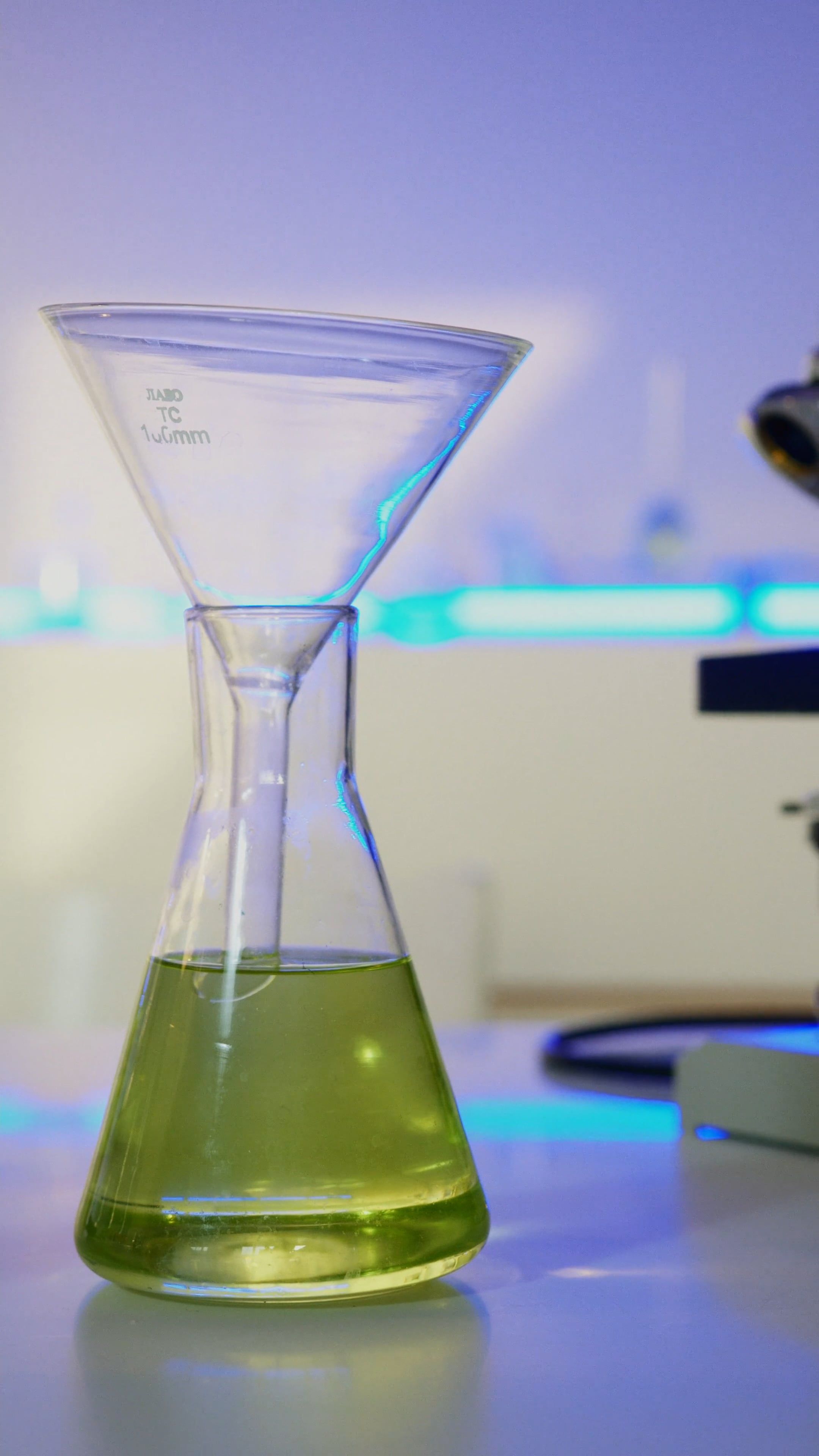 Close up of a Funnel in an Erlenmeyer Flask · Free Stock Video