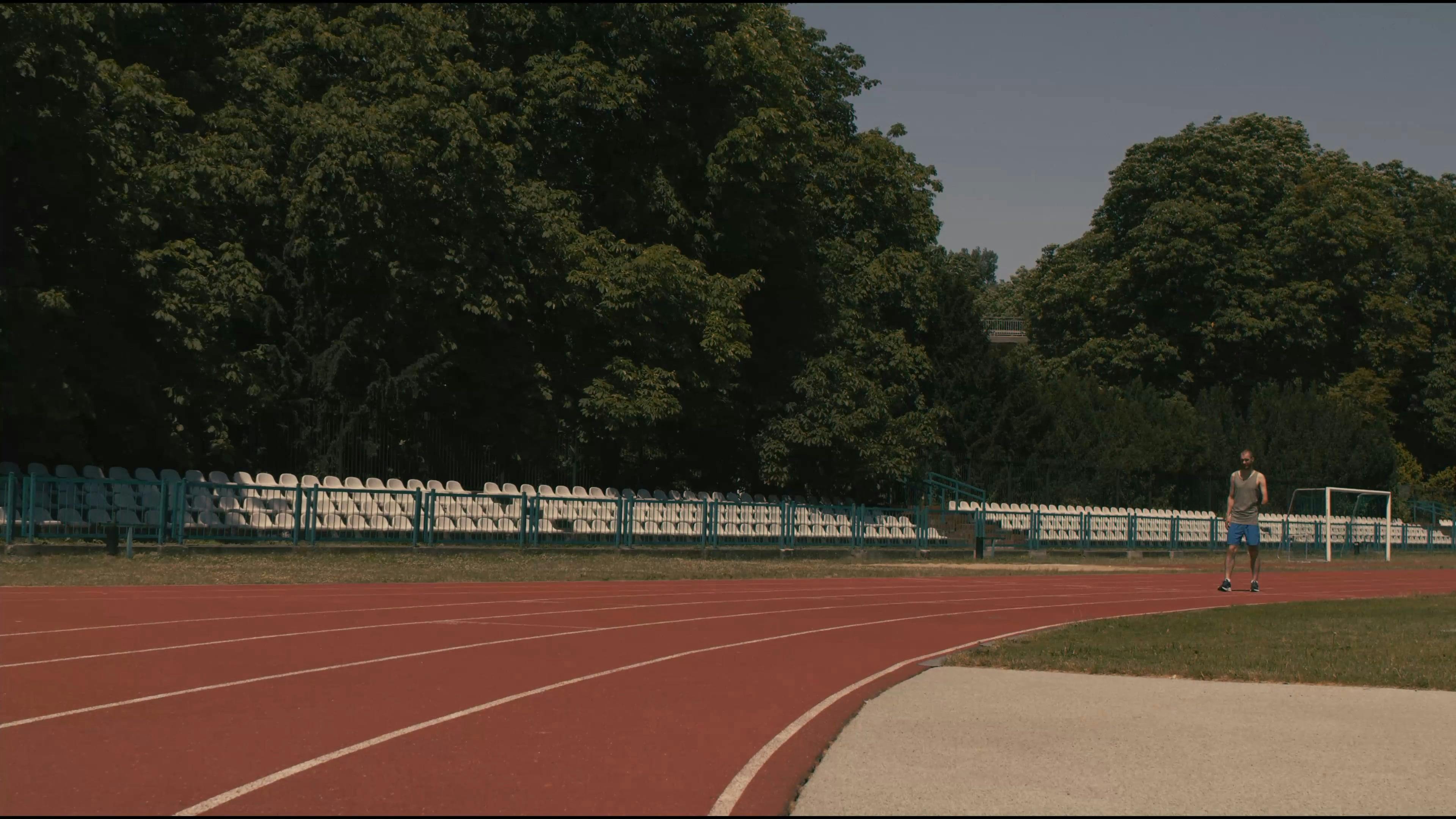 Panning Shot of a Man Running at a Track Free Stock Video Footage ...