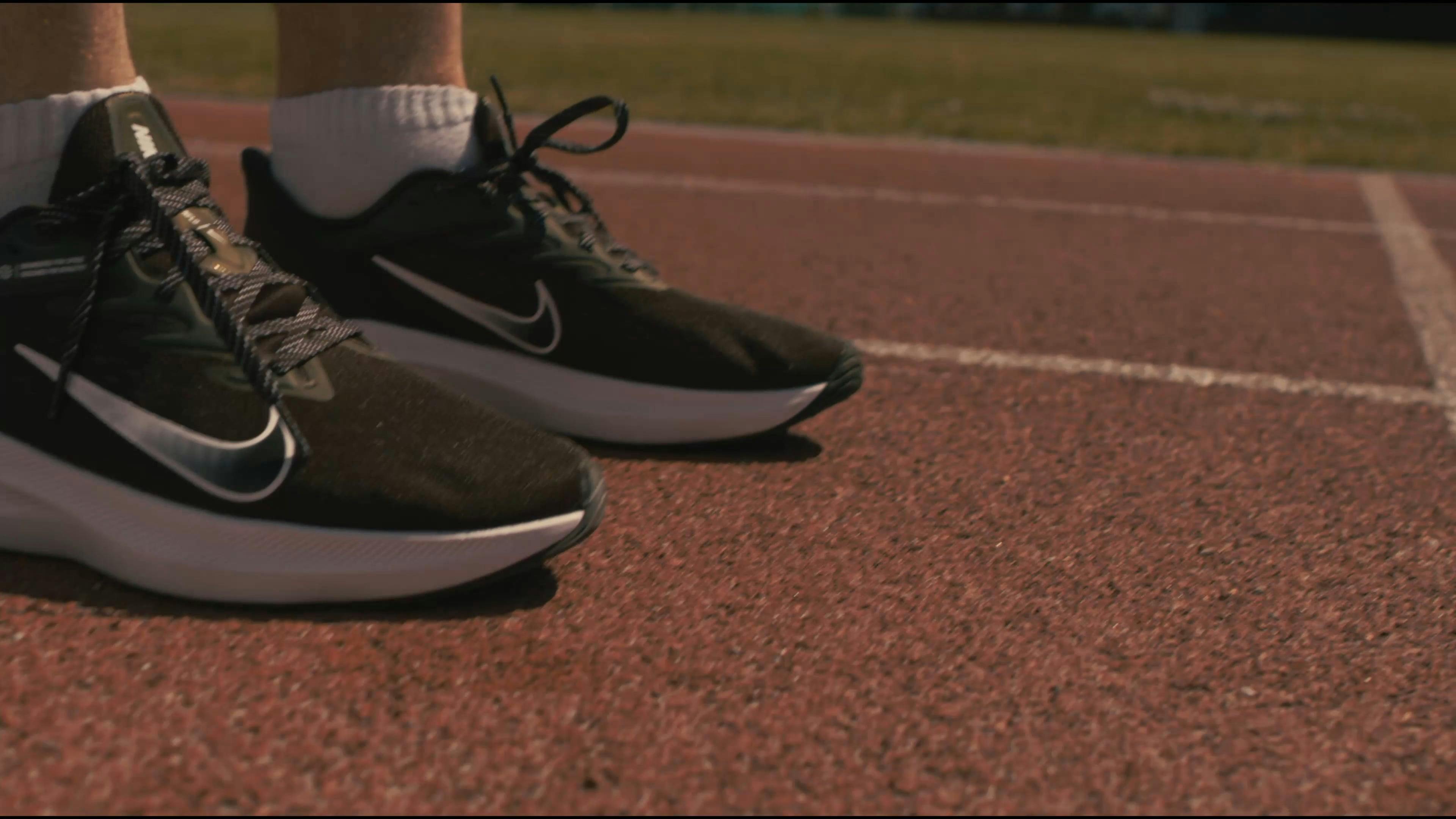 A Ground Level Shot of a Person Running at a Track Free Stock Video ...