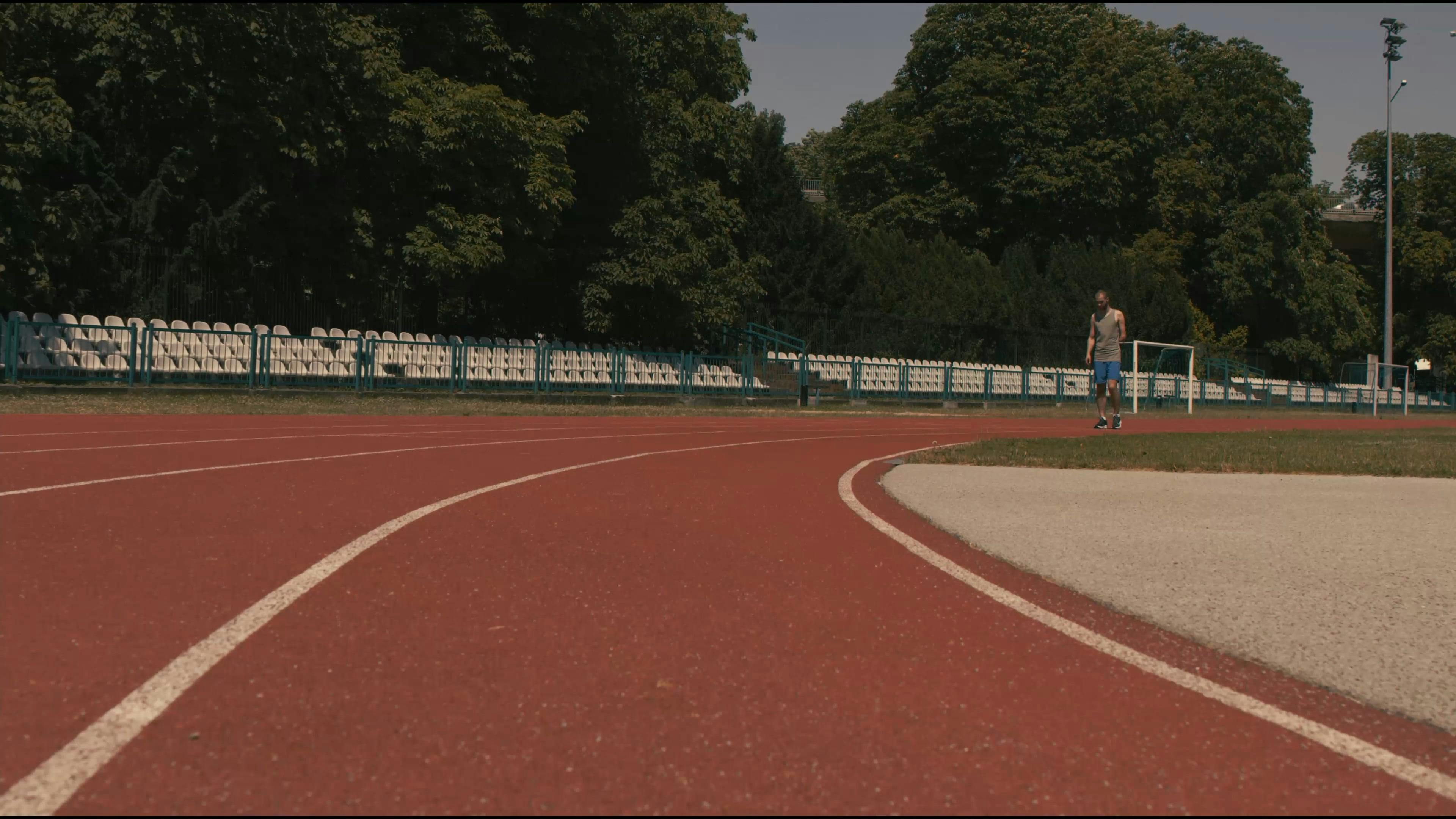 Knee Level Shot of a Man Running at a Track Free Stock Video Footage ...