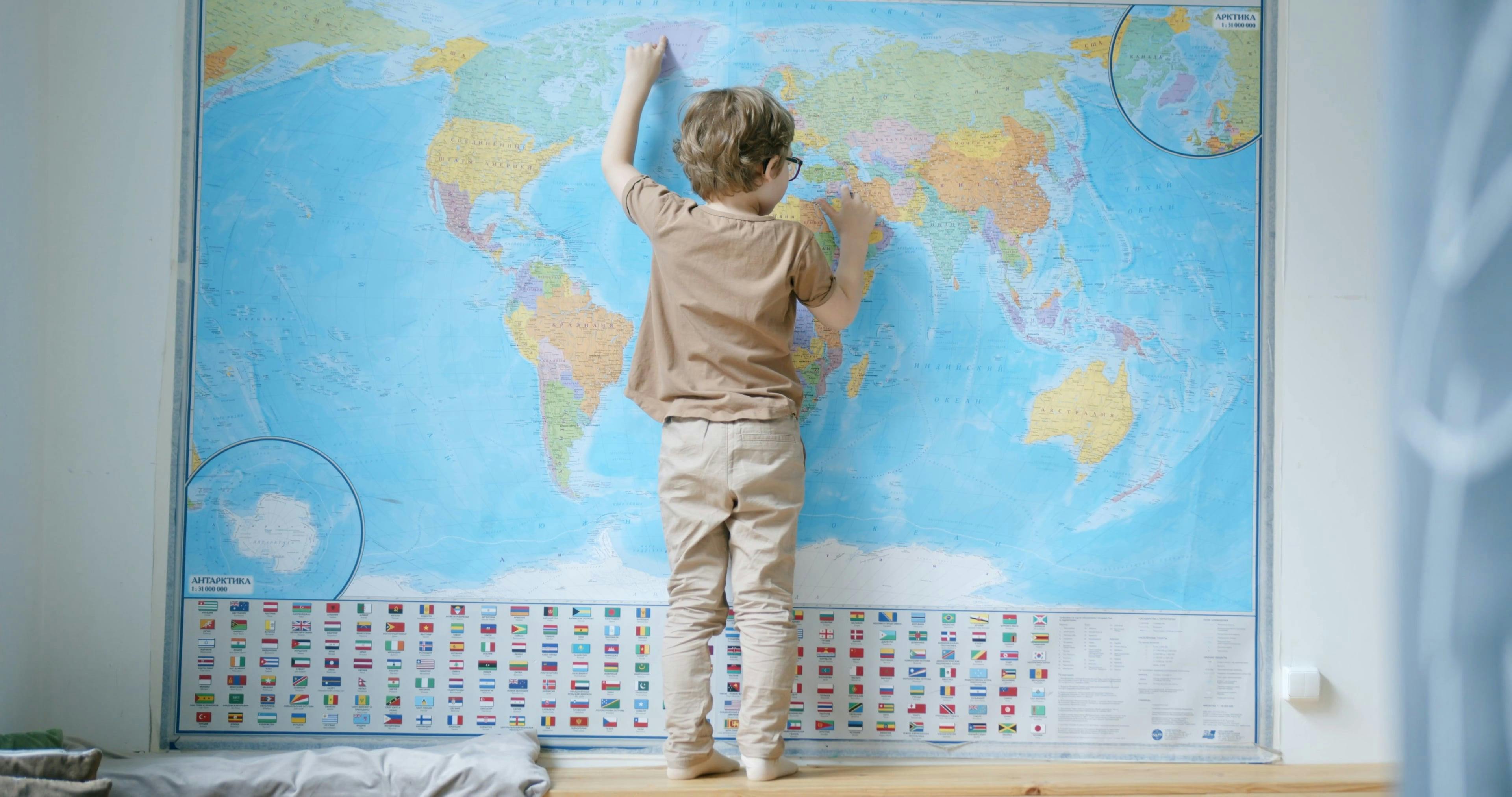 Full Shot from behind of a Little Boy Pointing and Looking at a Huge ...