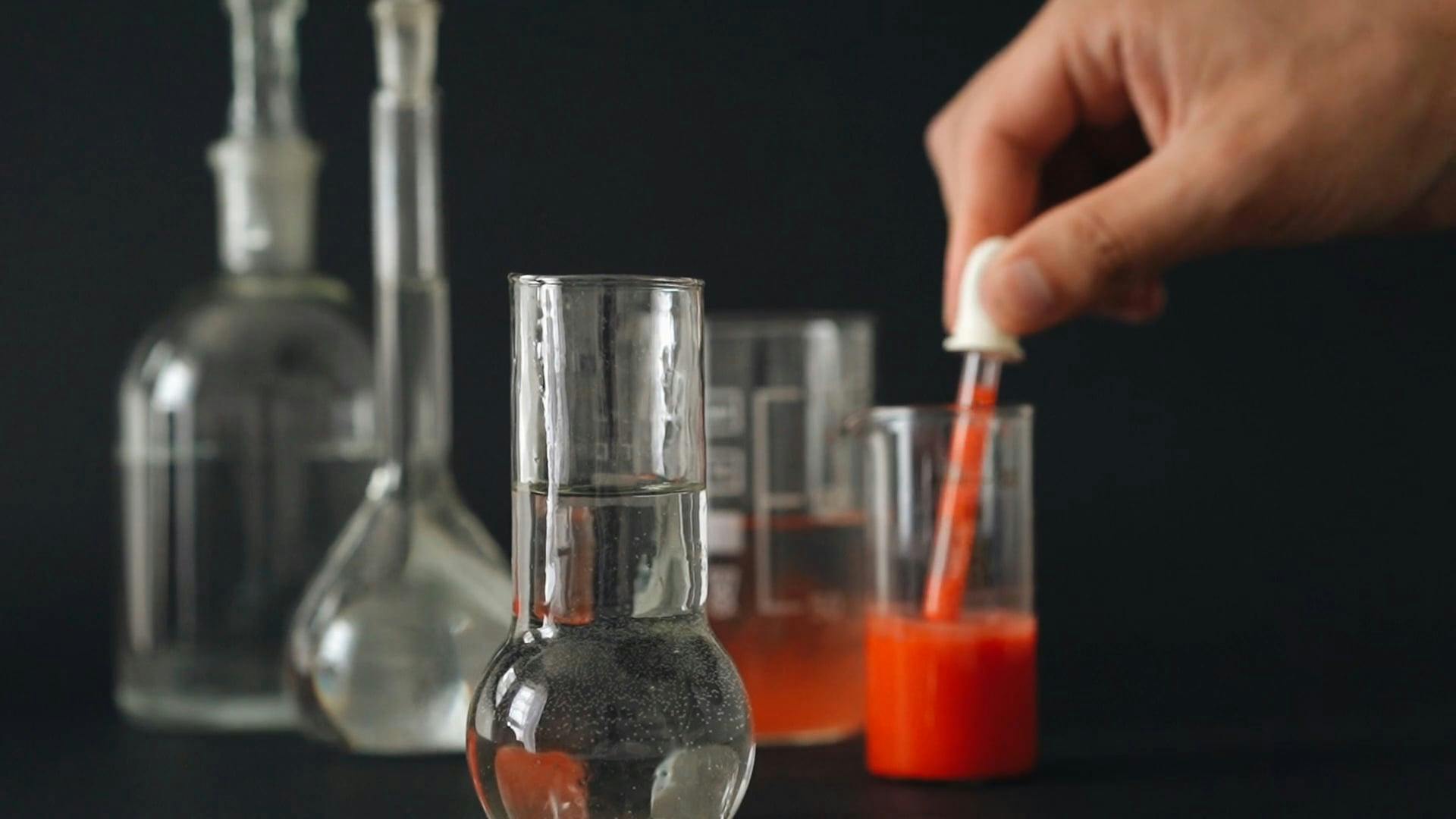 A Dropper Pouring Liquid in to the Black Bottle · Free Stock Video