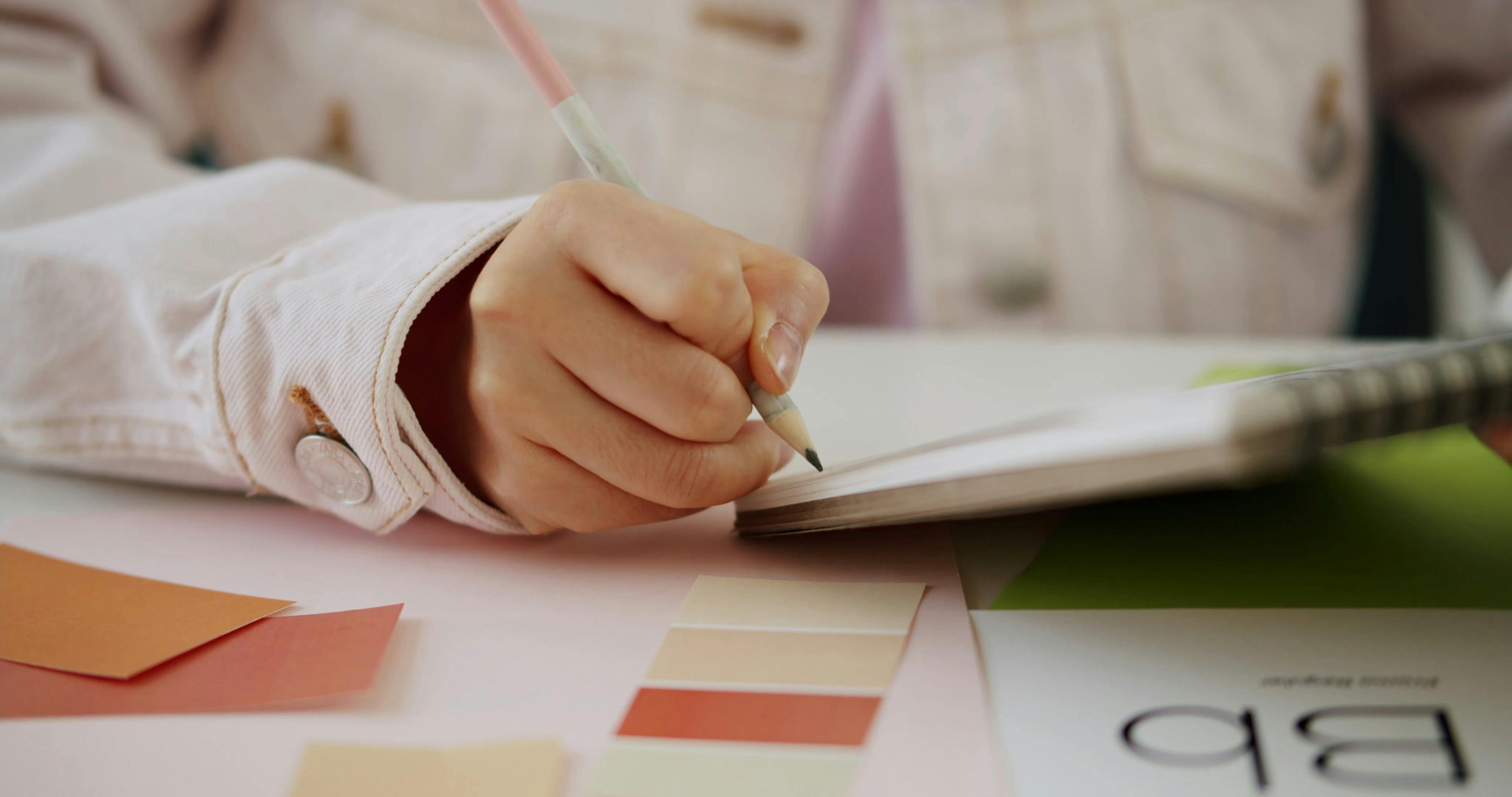 Writing And Erasing On A Sheet Of Paper · Free Stock Video