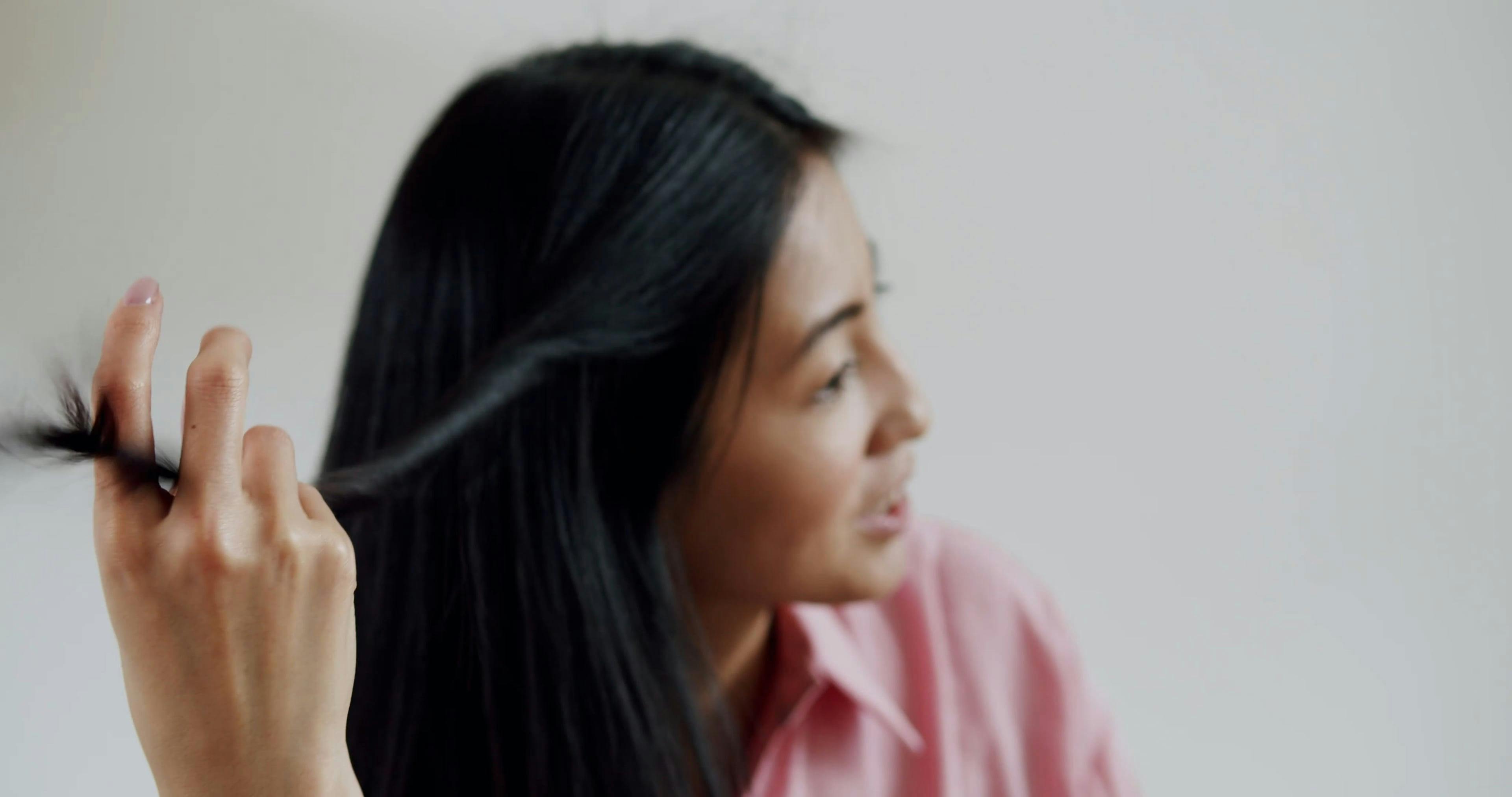 A Woman Twirling her Hair · Free Stock Video