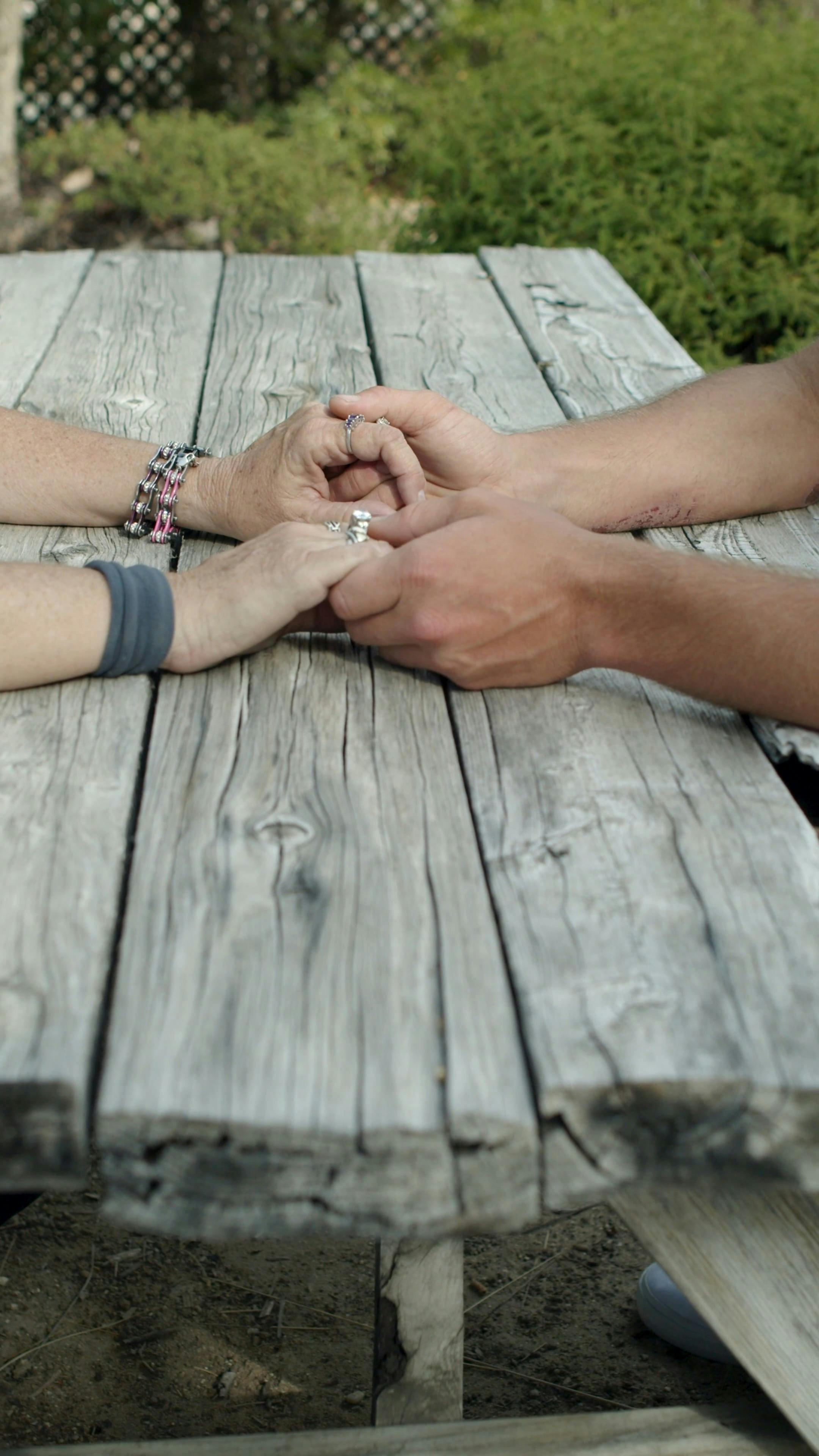 People Holding Hands at a Wooden Table Free Stock Video Footage ...