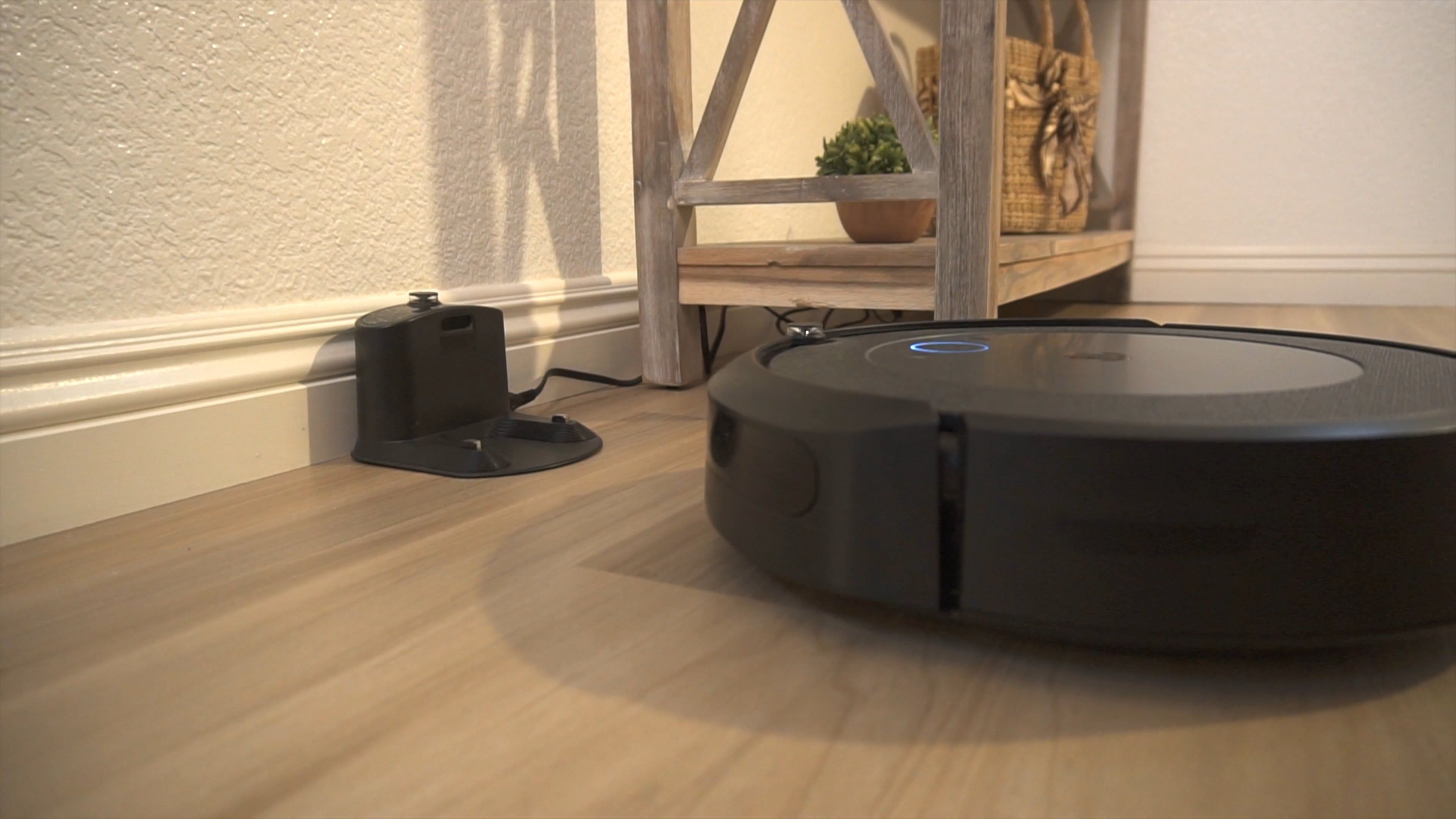 A Robotic Vacuum Cleaner Returning to Its Base · Free Stock Video