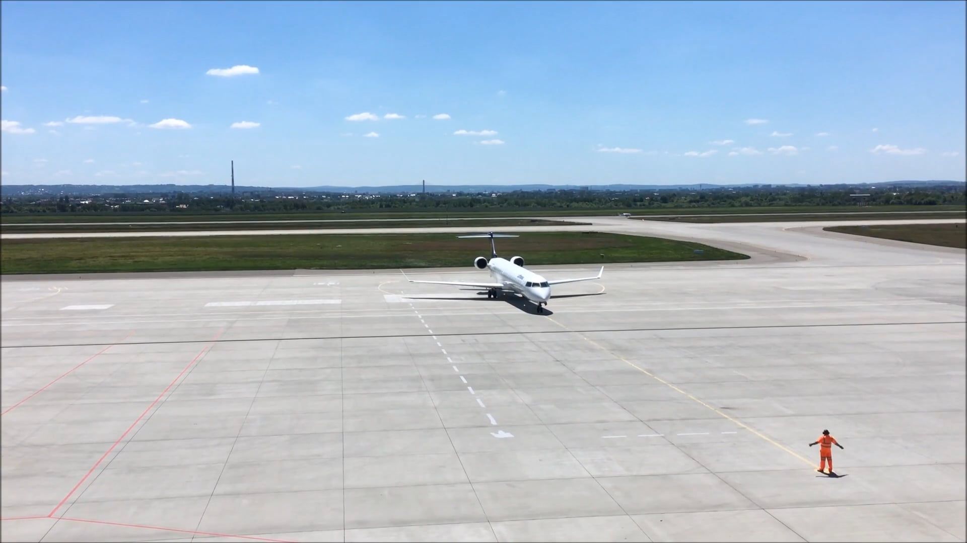 Man Assisting An Airplane In Runway · Free Stock Video