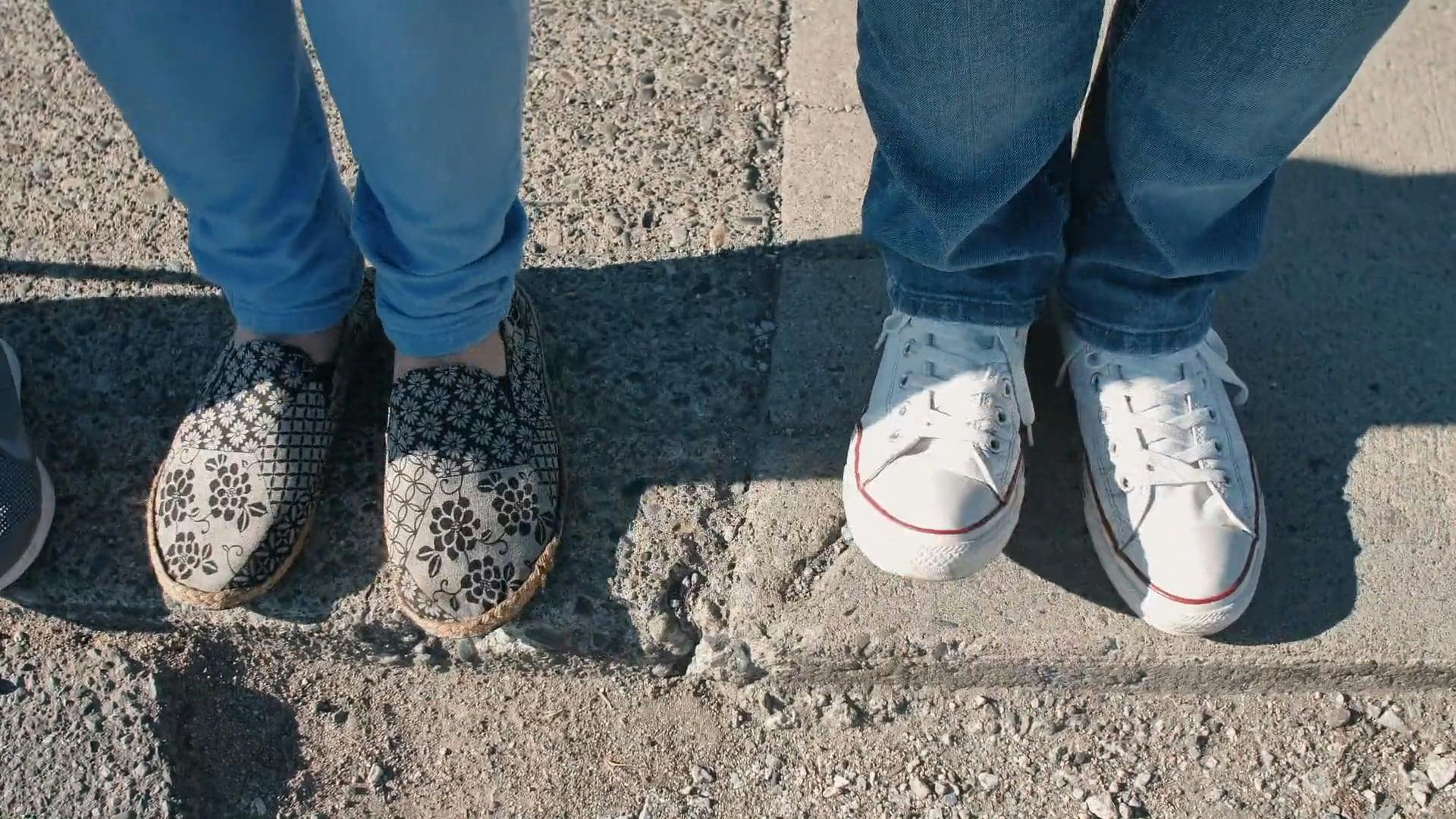 High-Angle Shot of Two People Wearing Shoes Tapping Their Feet Free ...