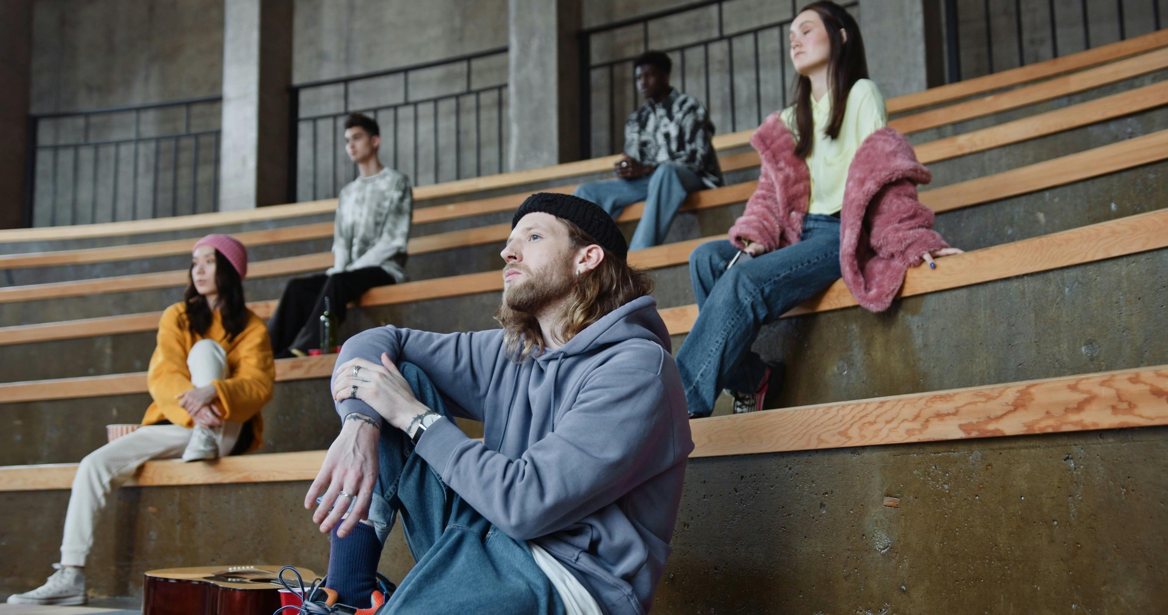 People Sitting on Bench while Looking at Camera · Free Stock Video