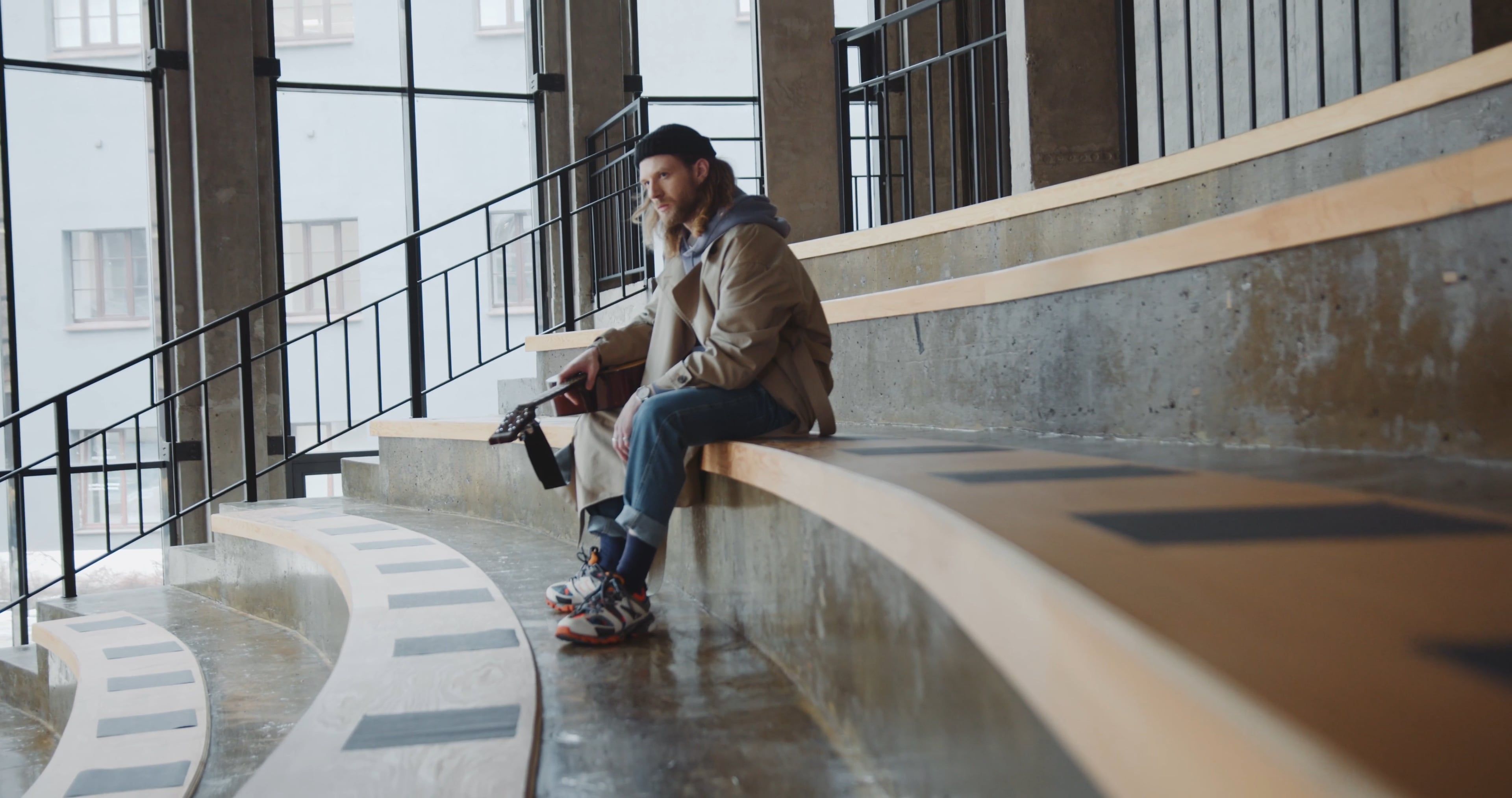 A Man Sitting on the Steps of an Amphitheater Free Stock Video Footage ...